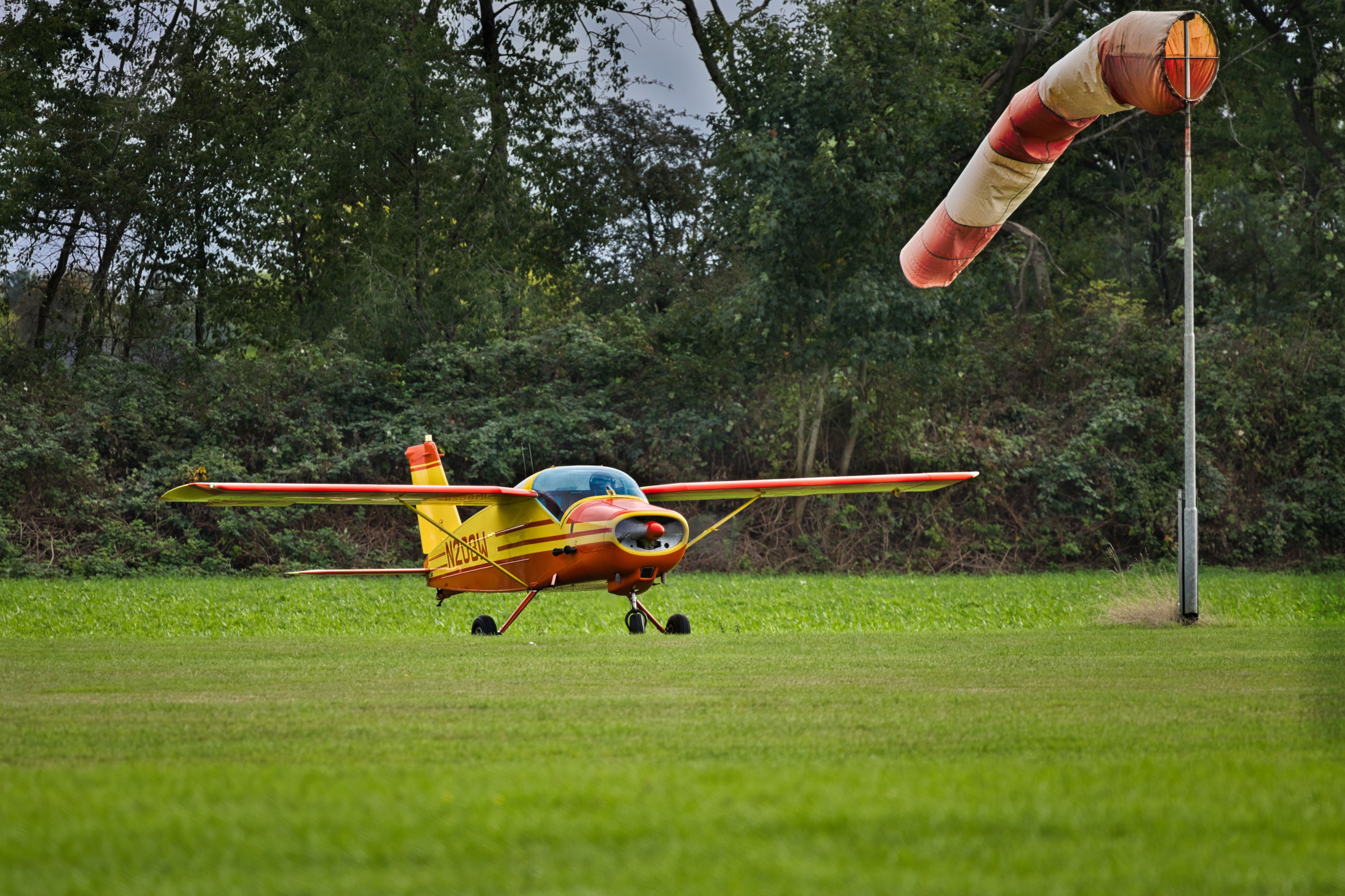Bright Yellow Airplane Preparing for Takeoff · Free Stock Photo