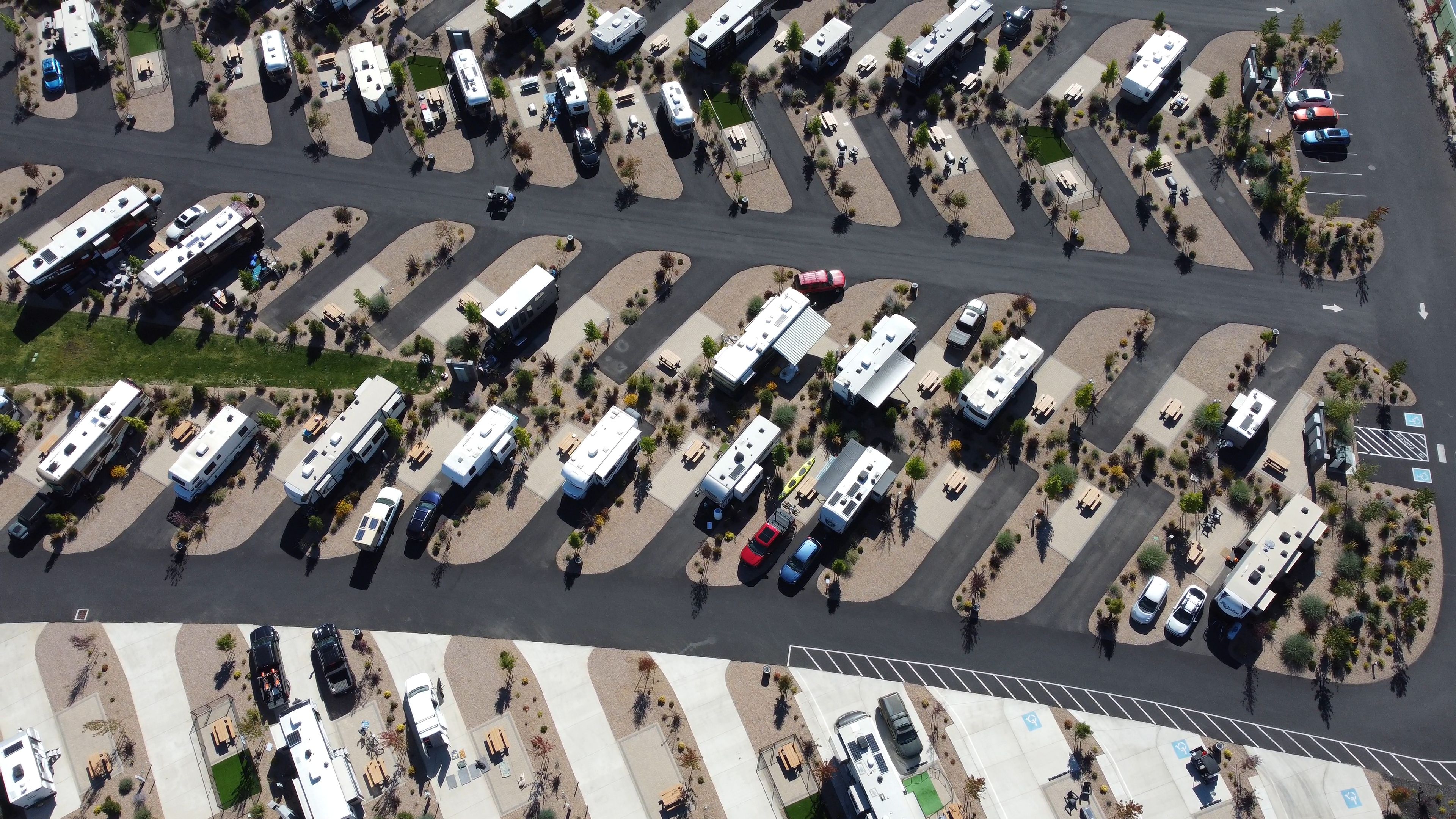 Aerial View of Modern RV Park with Campers · Free Stock Photo