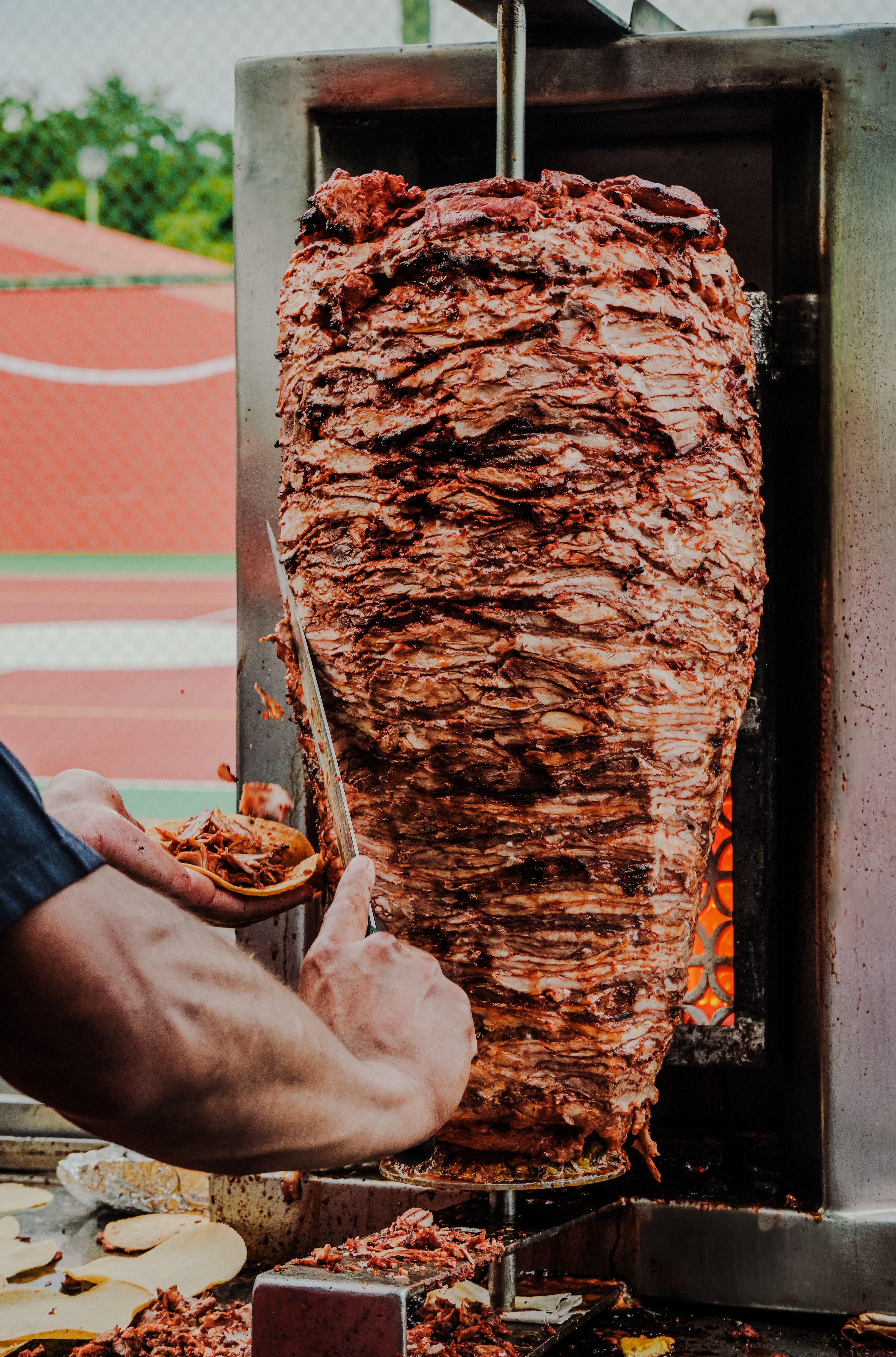 Delicious Al Pastor Meat on Vertical Spit · Free Stock Photo