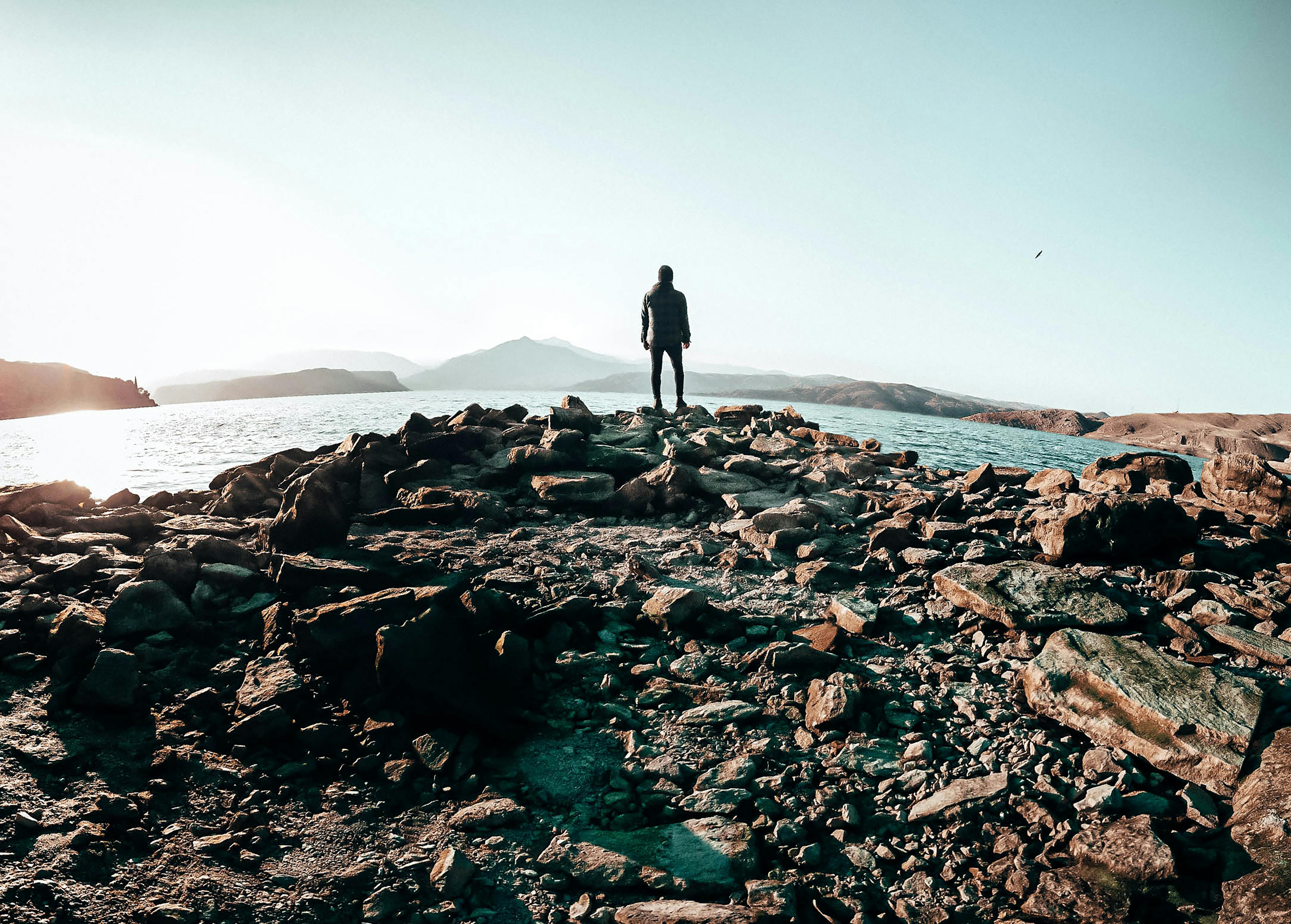 Person Standing in Rocks · Free Stock Photo