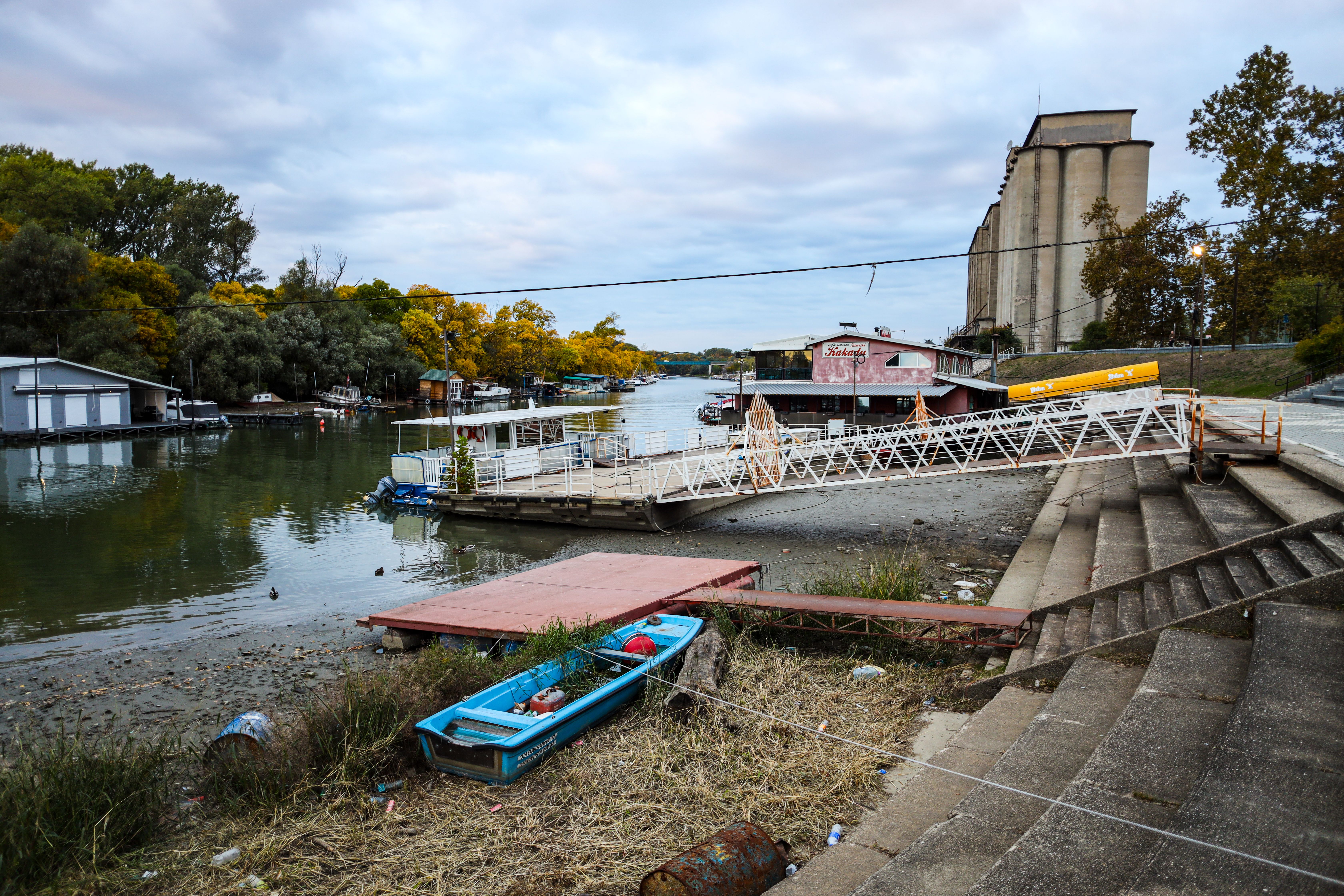 Rustic Riverfront with Dock and Autumn Trees · Free Stock Photo