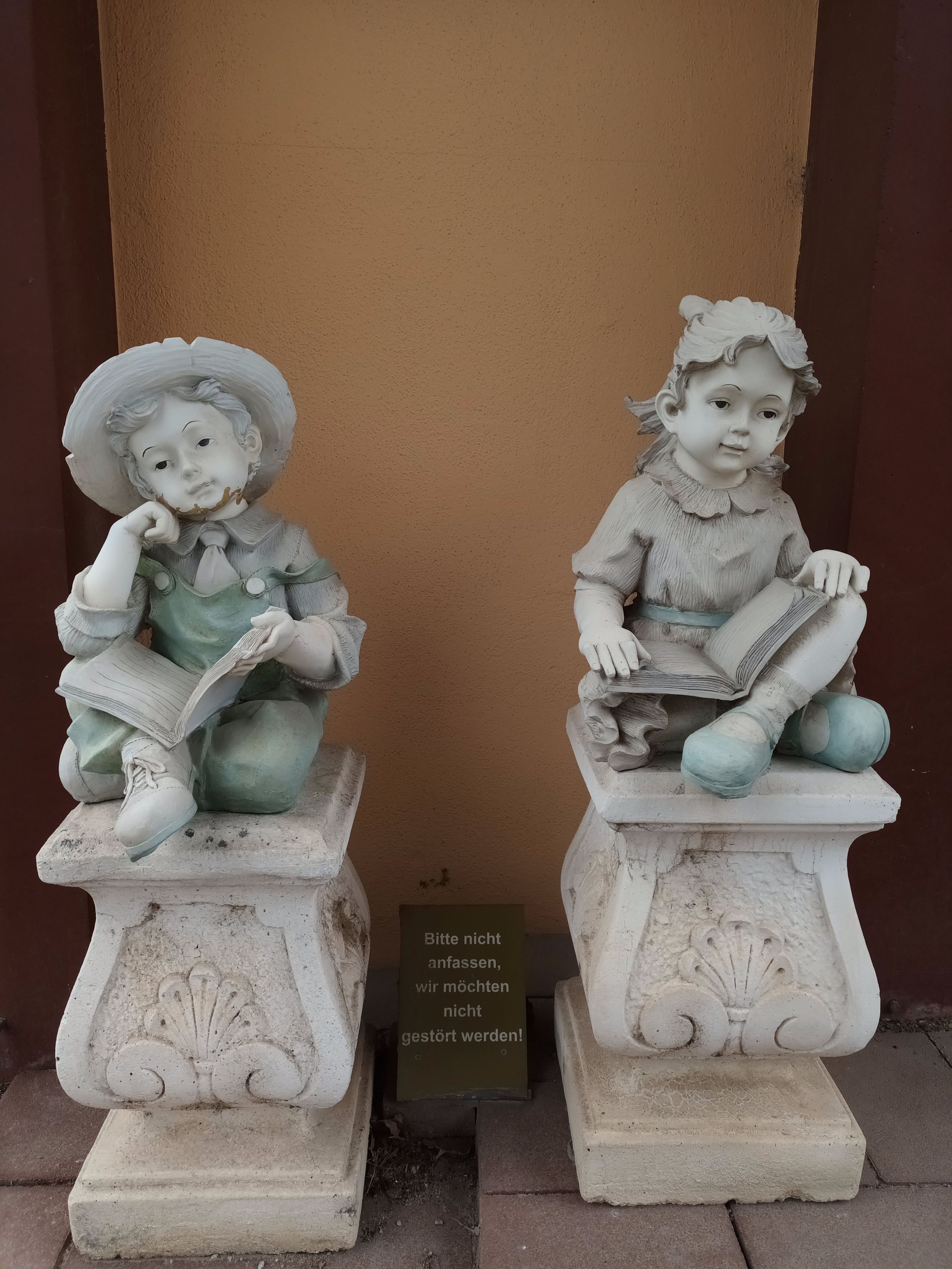 Decorative Child Statues on Pedestals Outside · Free Stock Photo