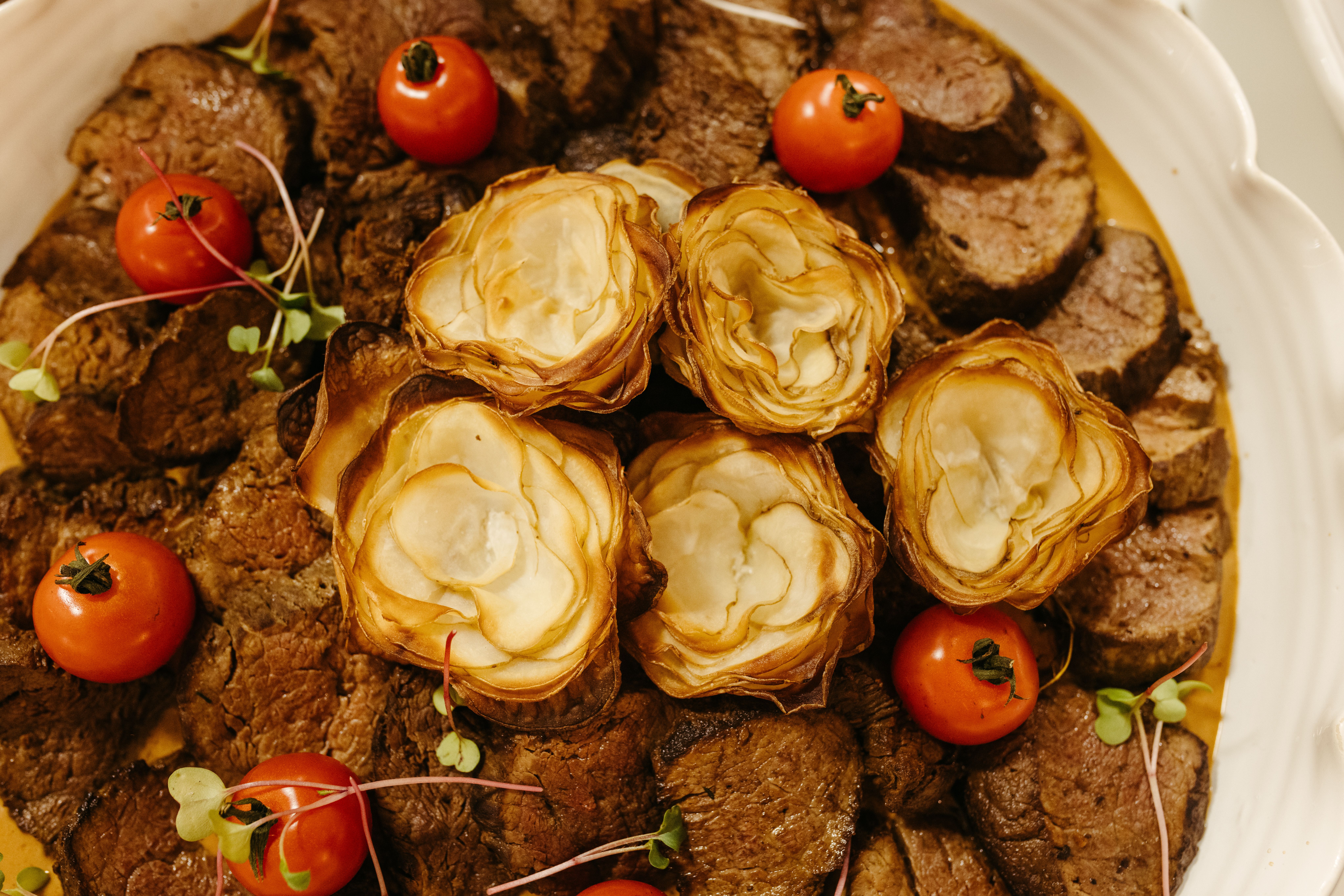 Rustic Gourmet Dish with Roasted Tomato Garnish · Free Stock Photo