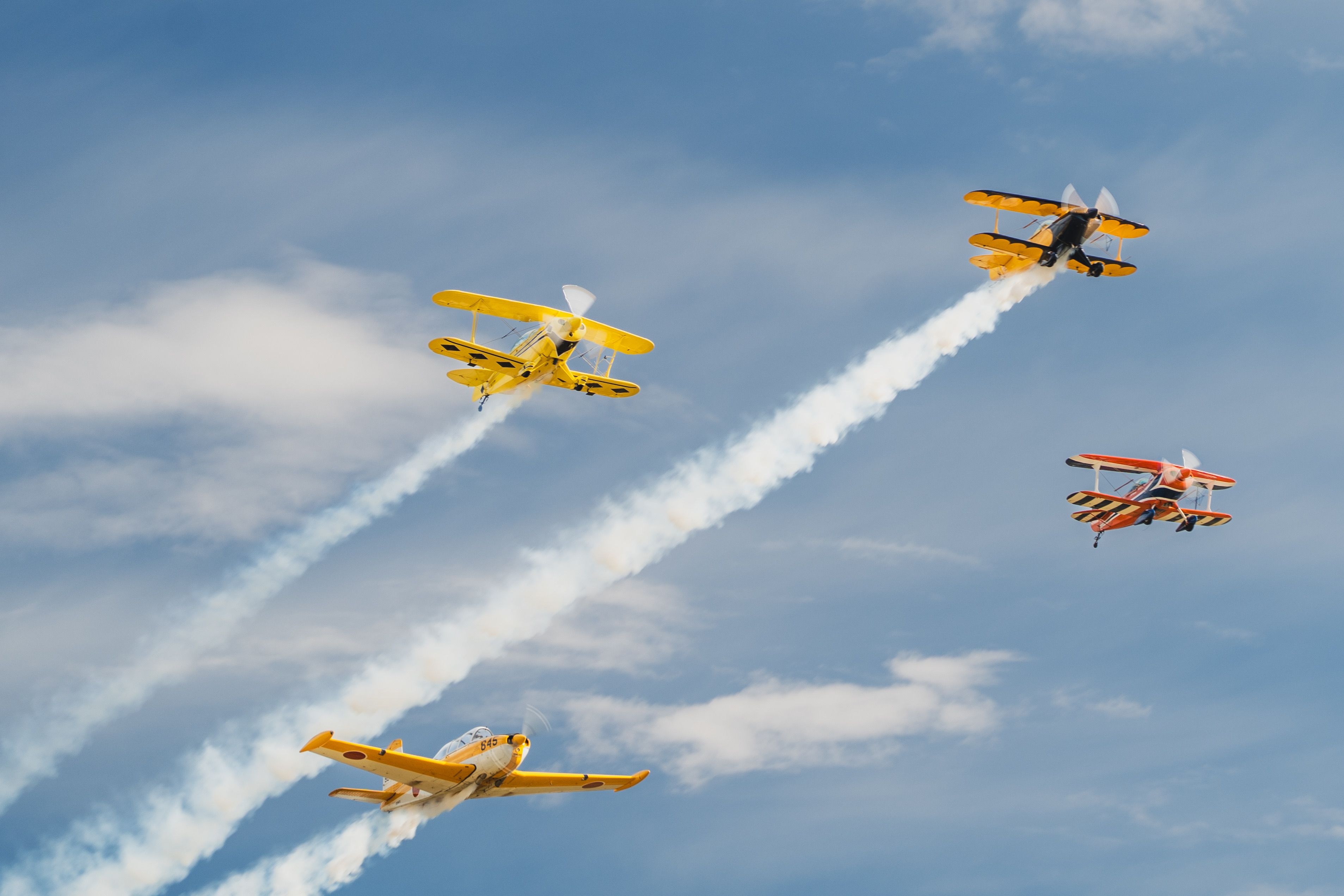 Aerobatic Planes Performing Against Blue Sky · Free Stock Photo