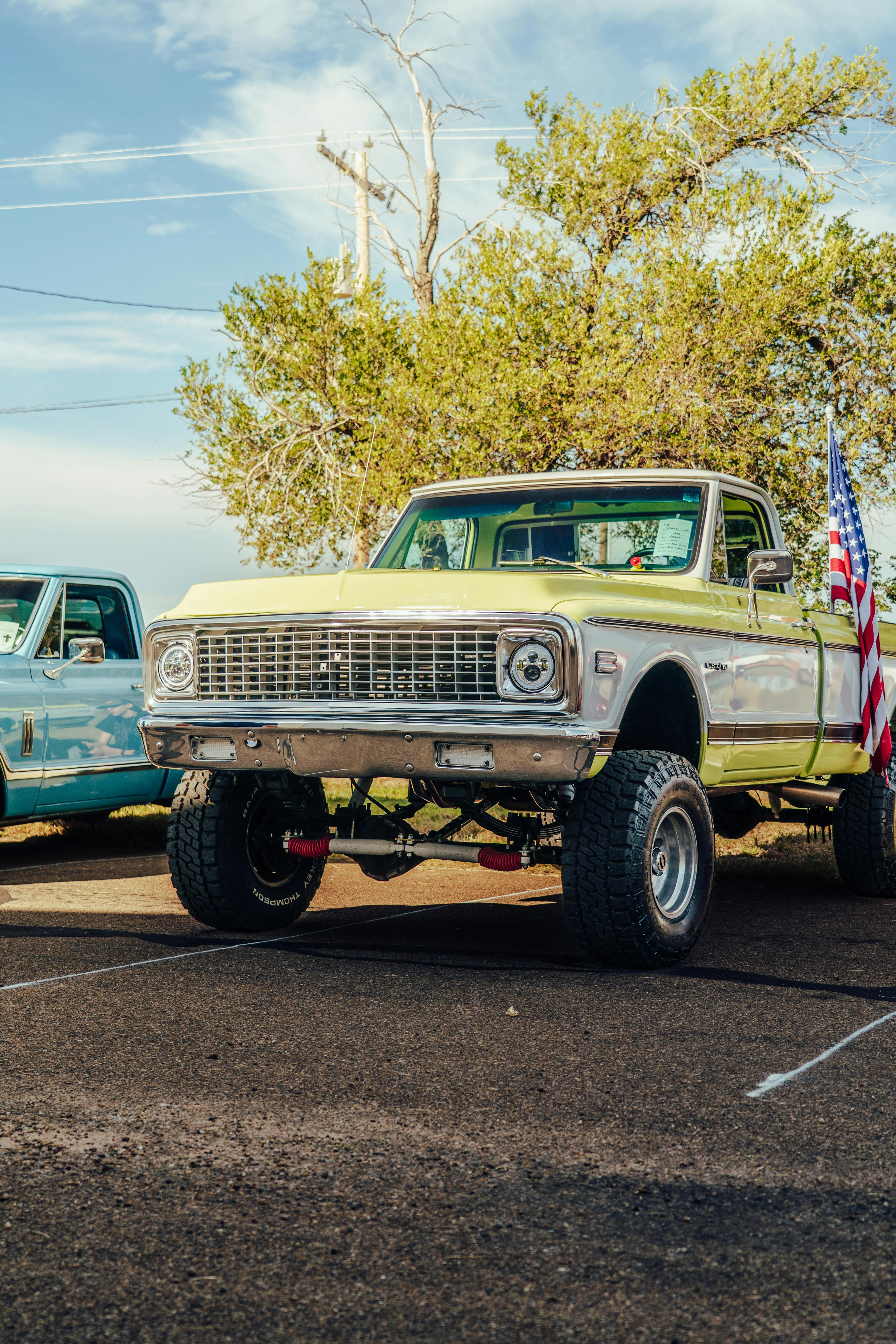 Classic Pickup Truck with American Flag Outdoors · Free Stock Photo