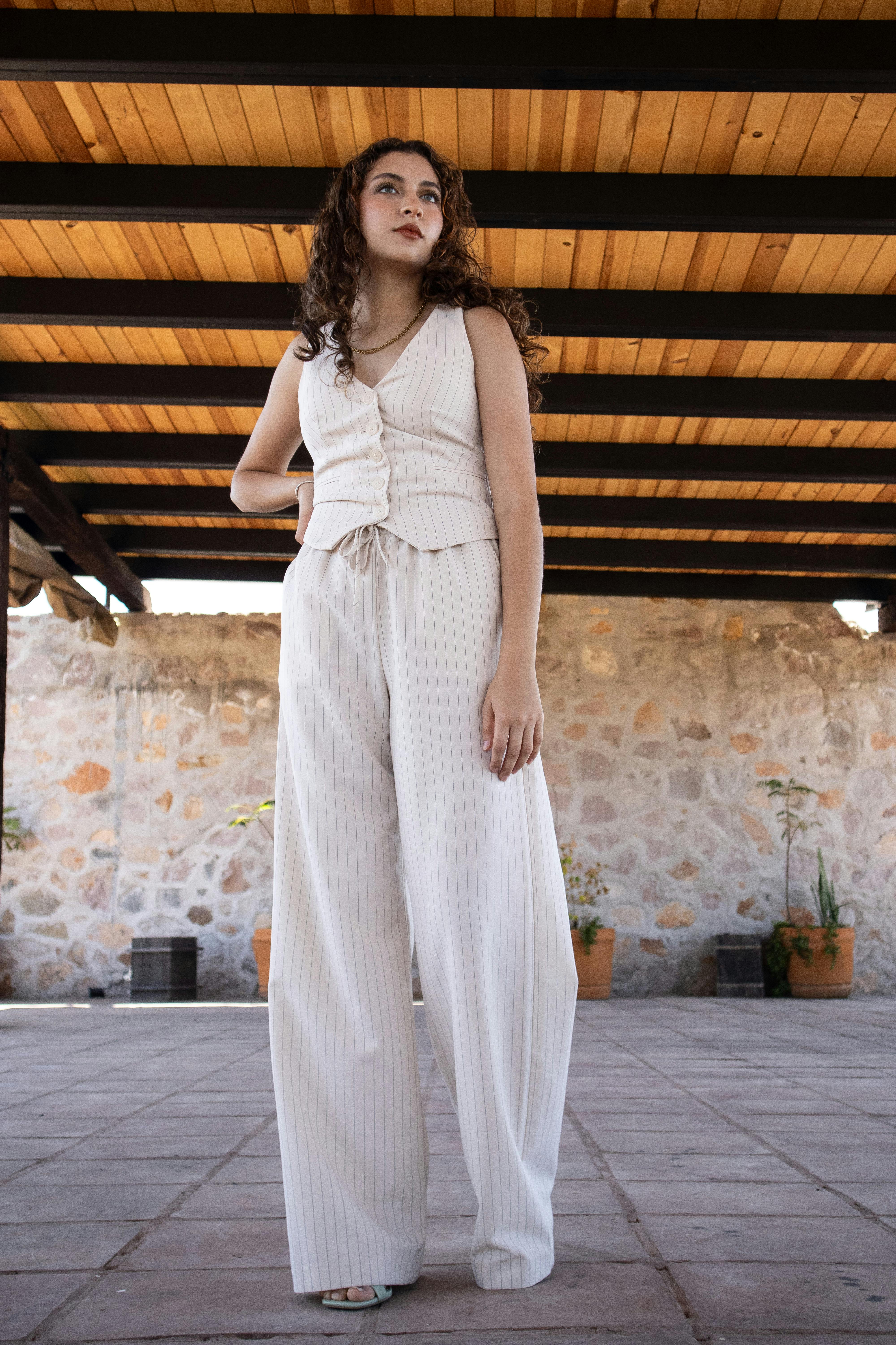 Chic Woman Posing in Elegant Jumpsuit Outdoors · Free Stock Photo