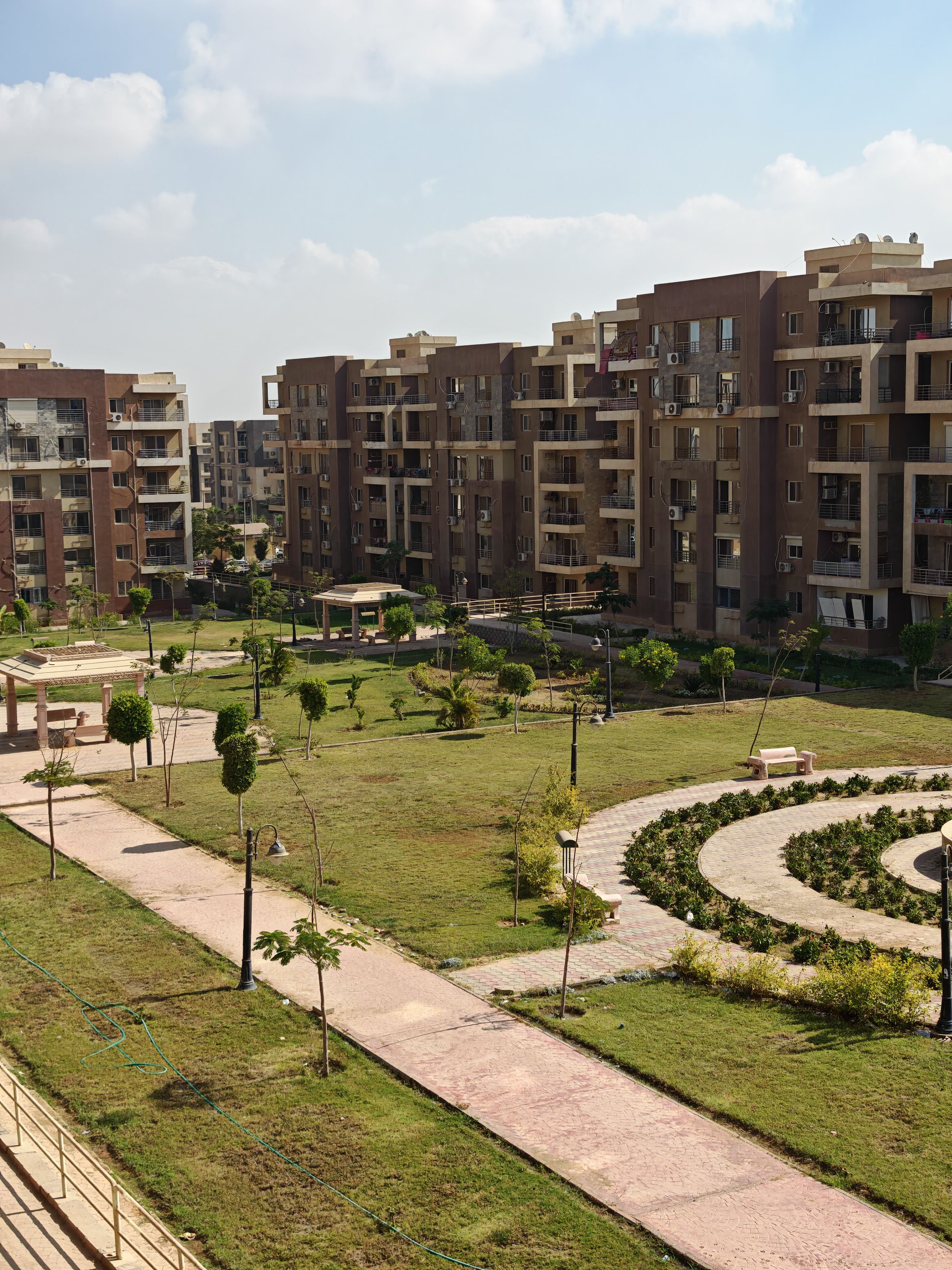 Modern Urban Apartment Complex with Green Park · Free Stock Photo