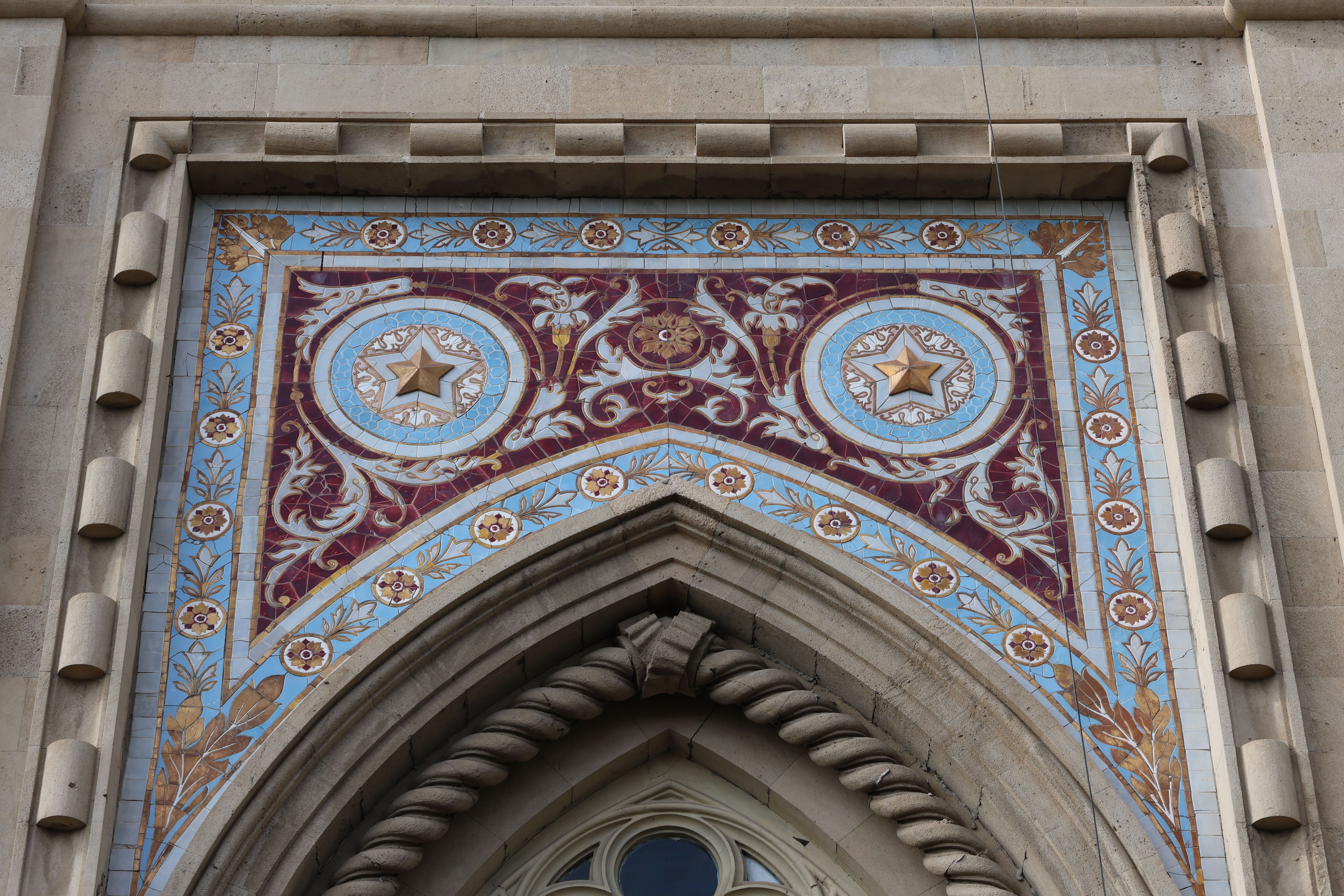 Detailed Architectural Tile Design on Historic Building · Free Stock Photo
