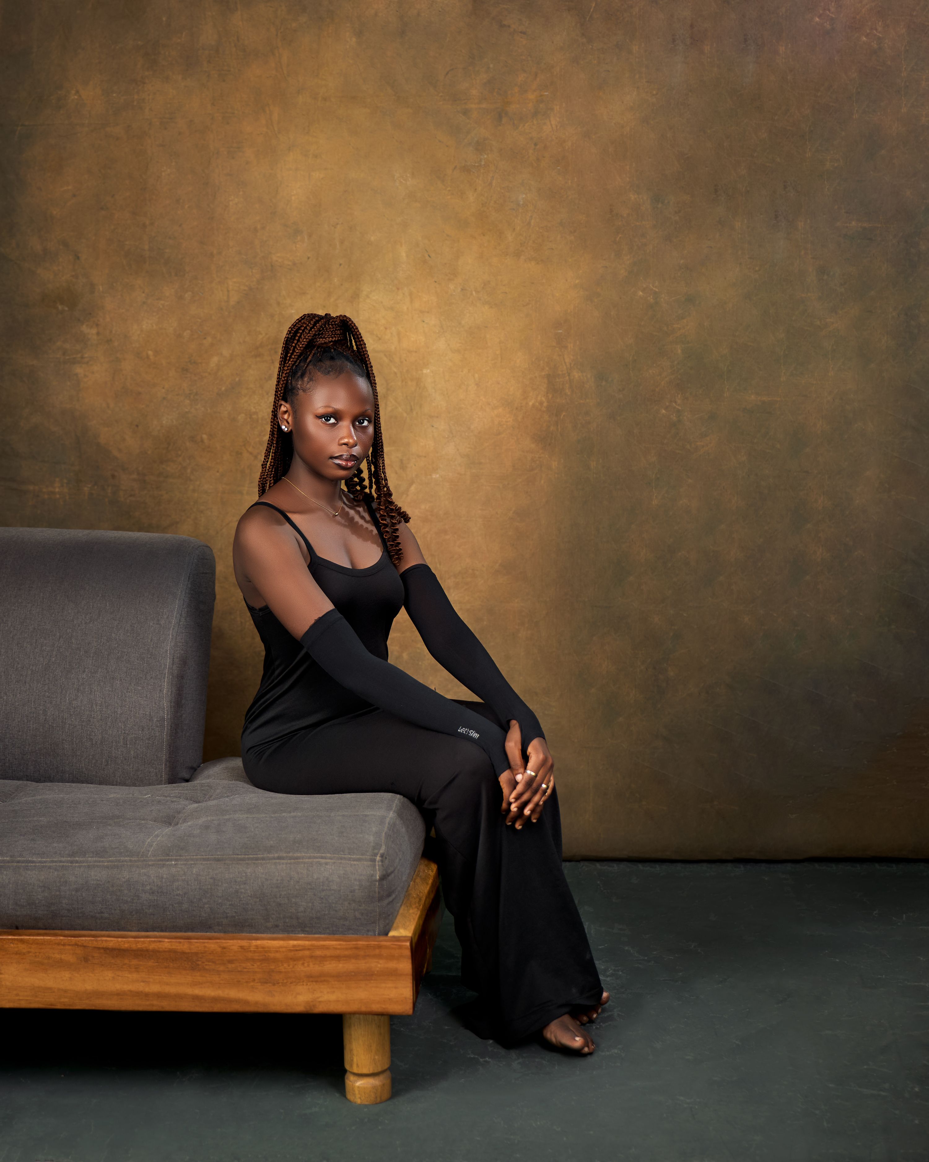 Elegant Portrait of Woman Sitting on Sofa · Free Stock Photo