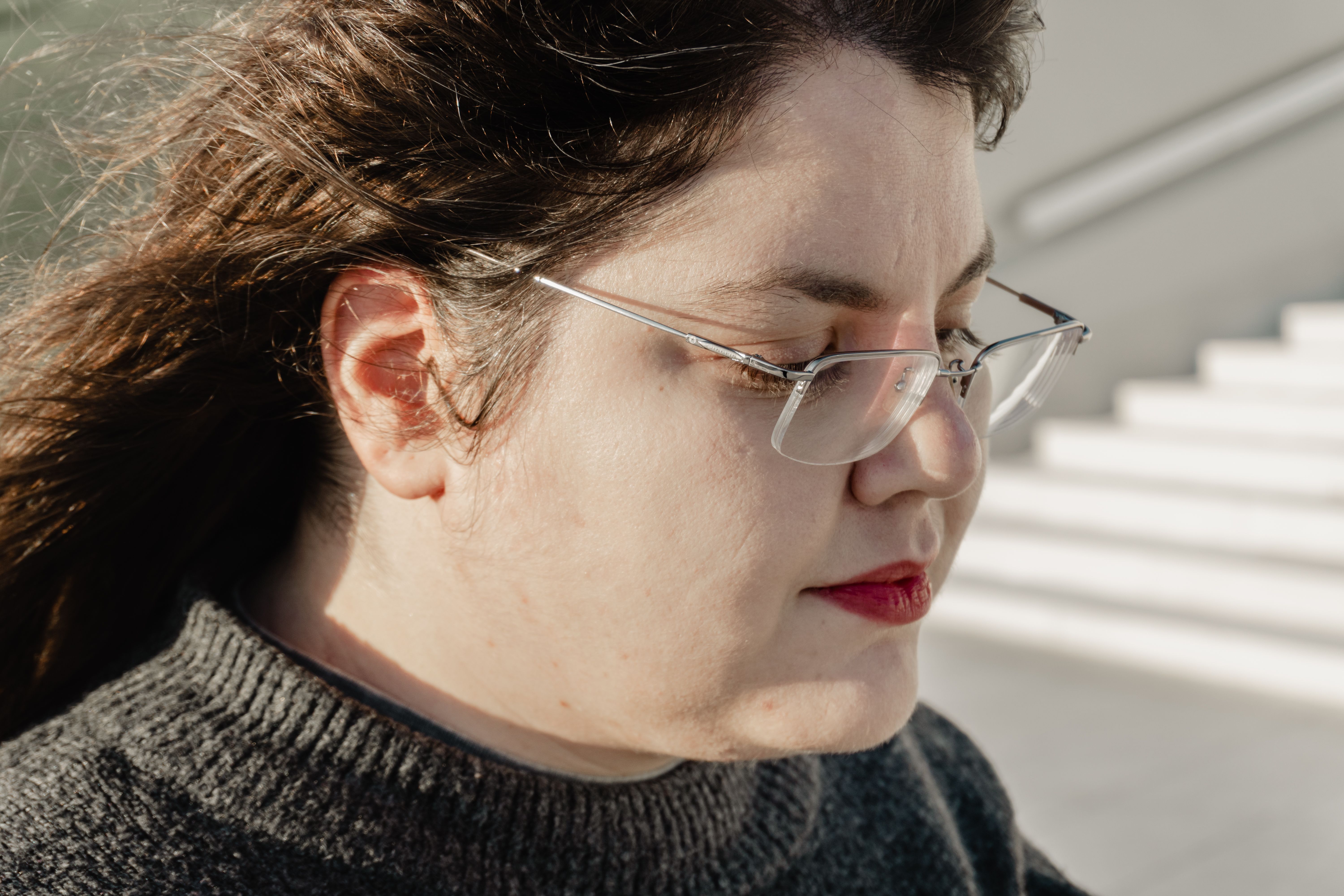 Reflective Woman in Glasses Outdoors Portrait · Free Stock Photo