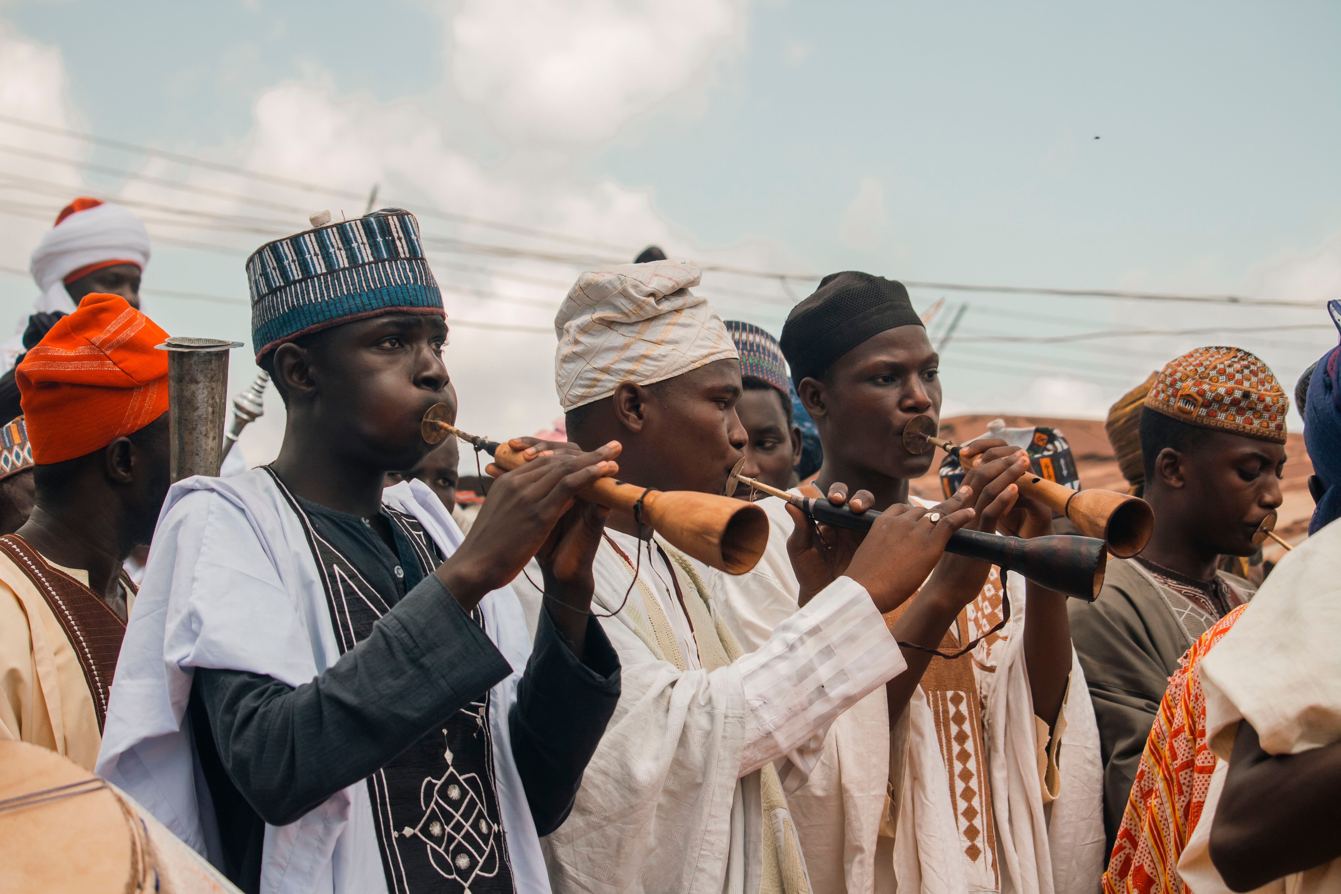 Traditional African Musicians Playing Wind Instruments · Free Stock Photo
