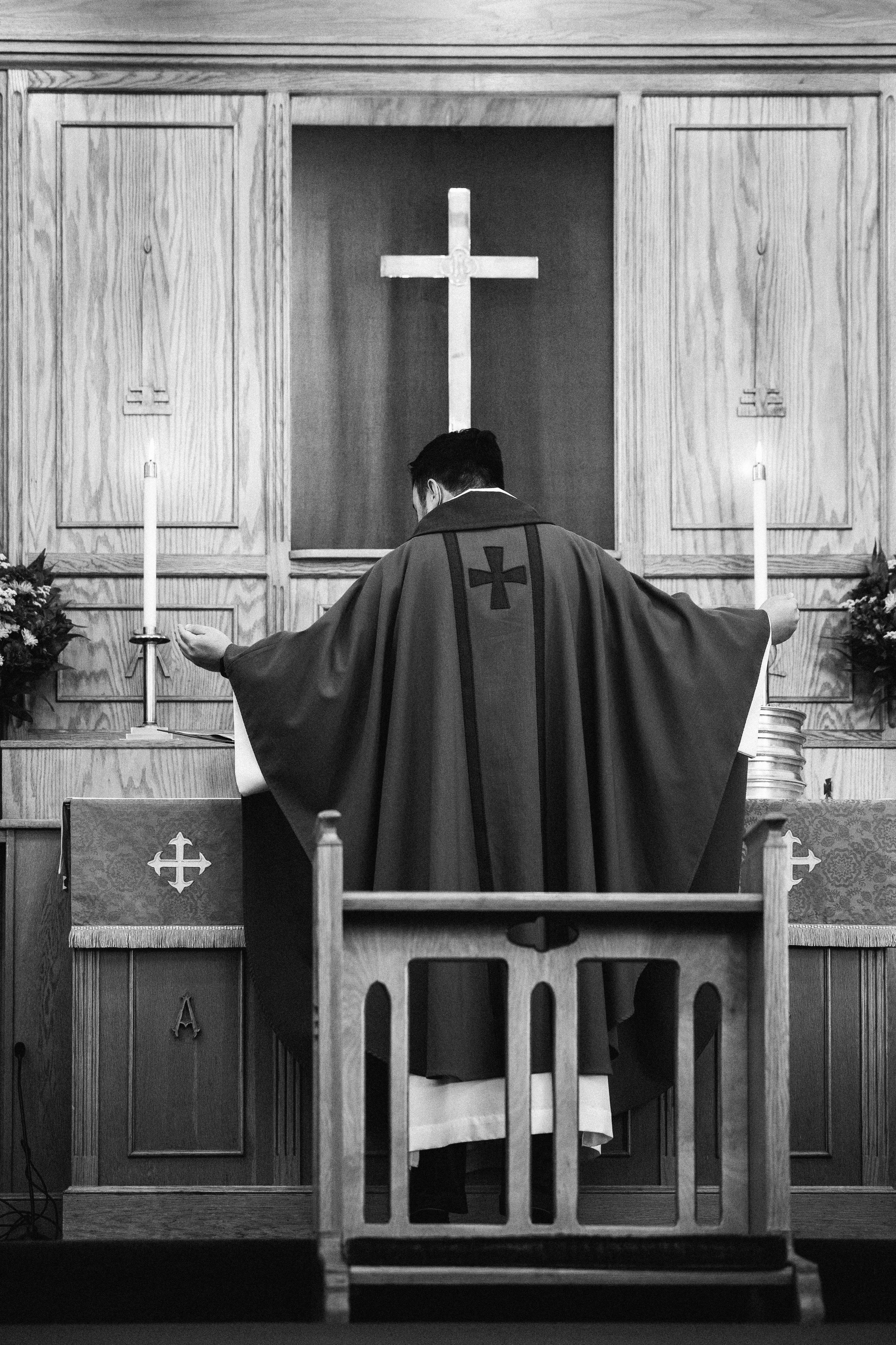 Priest Conducting Mass in Church Interior · Free Stock Photo