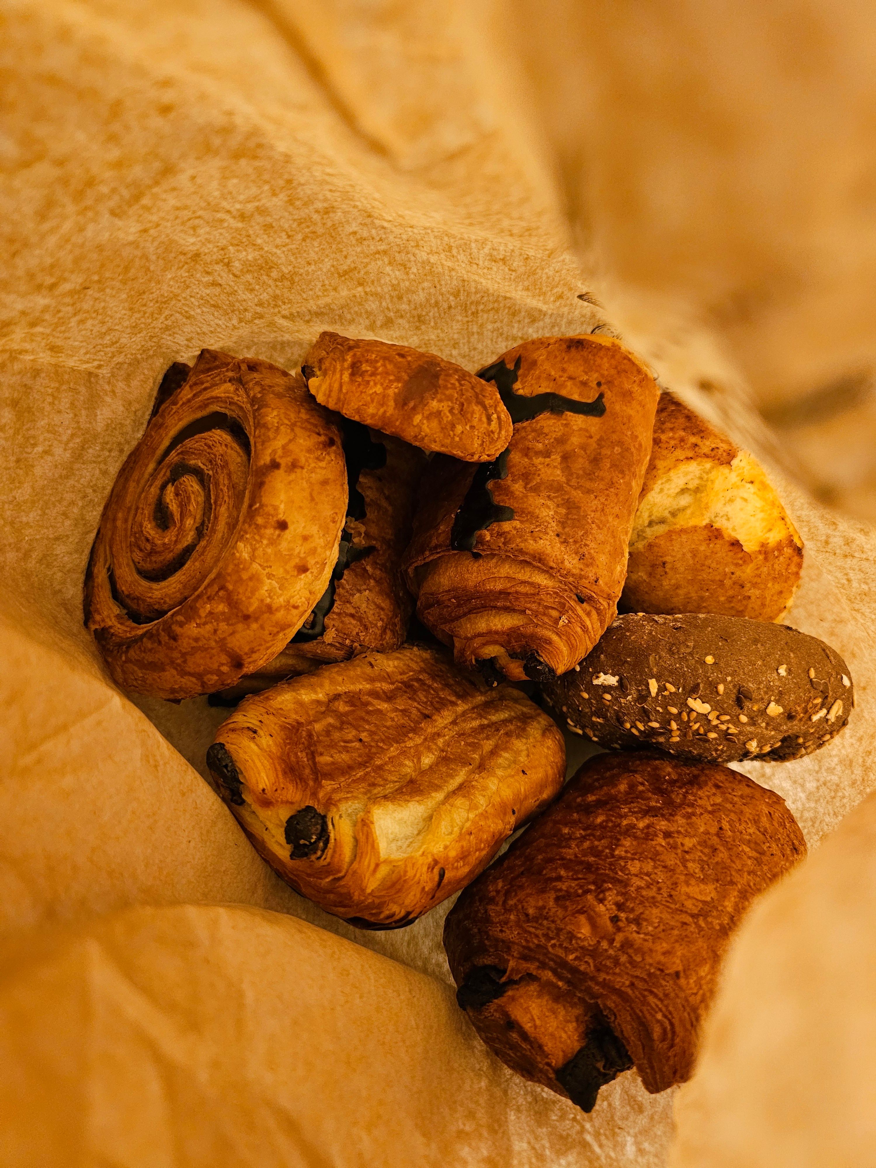 Assorted Fresh Baked Pastries in a Paper Bag · Free Stock Photo