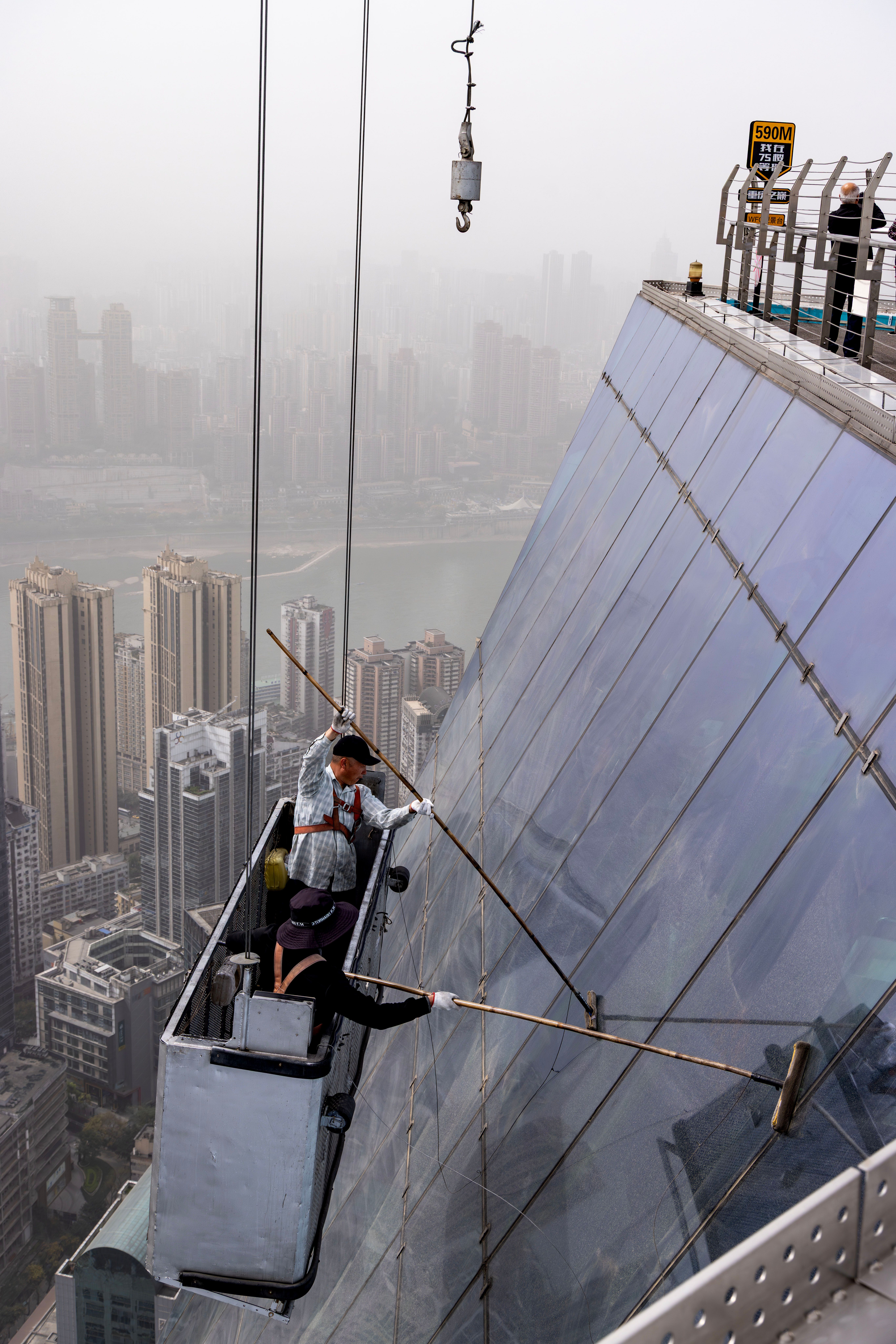 Workers Cleaning Skyscraper in Busy City Skyline · Free Stock Photo