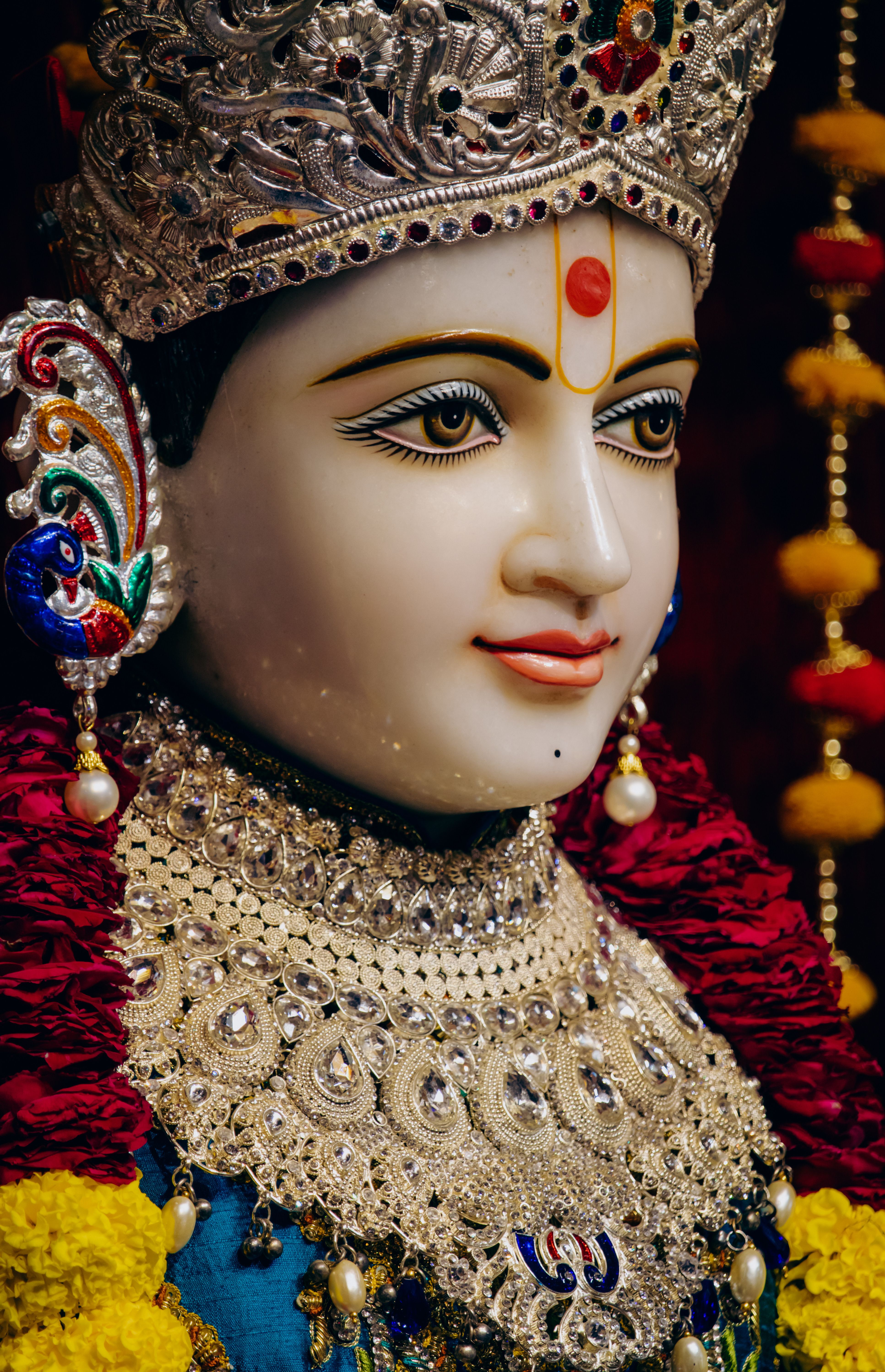 Intricate Hindu Deity Sculpture in Vibrant Colors · Free Stock Photo