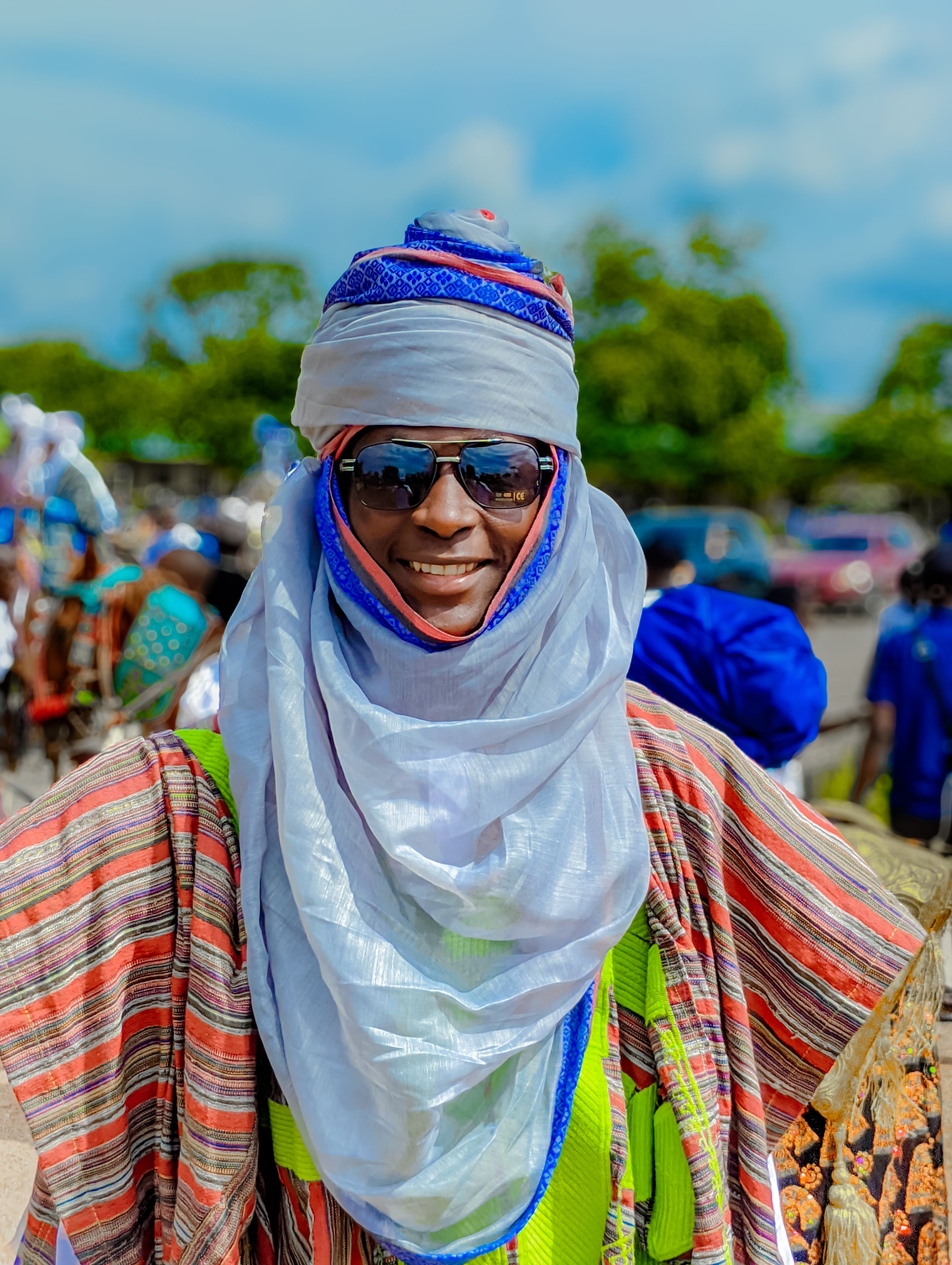 Smiling man in traditional African attire outdoors · Free Stock Photo