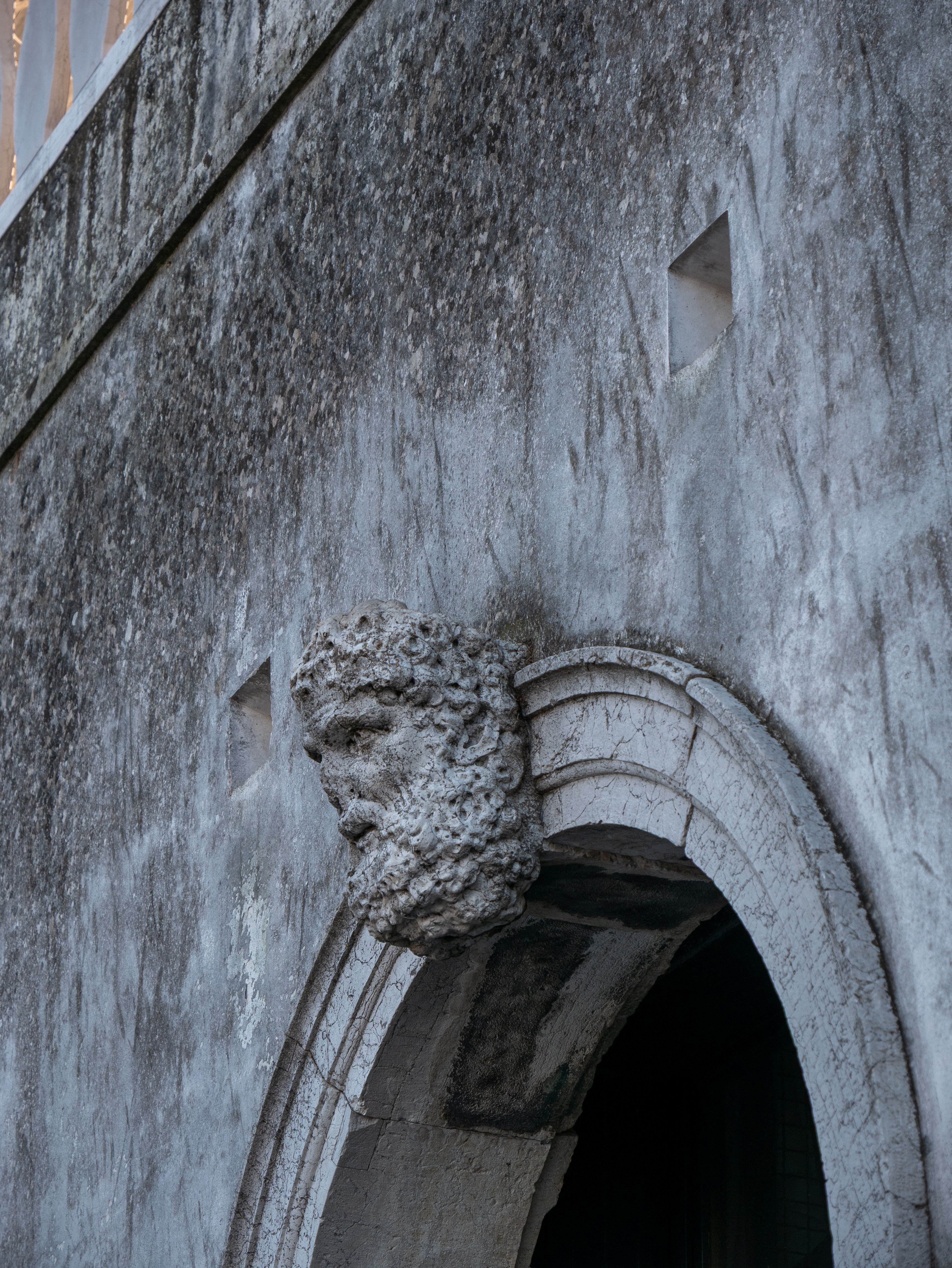Stone Face Sculpture on Historic Building · Free Stock Photo