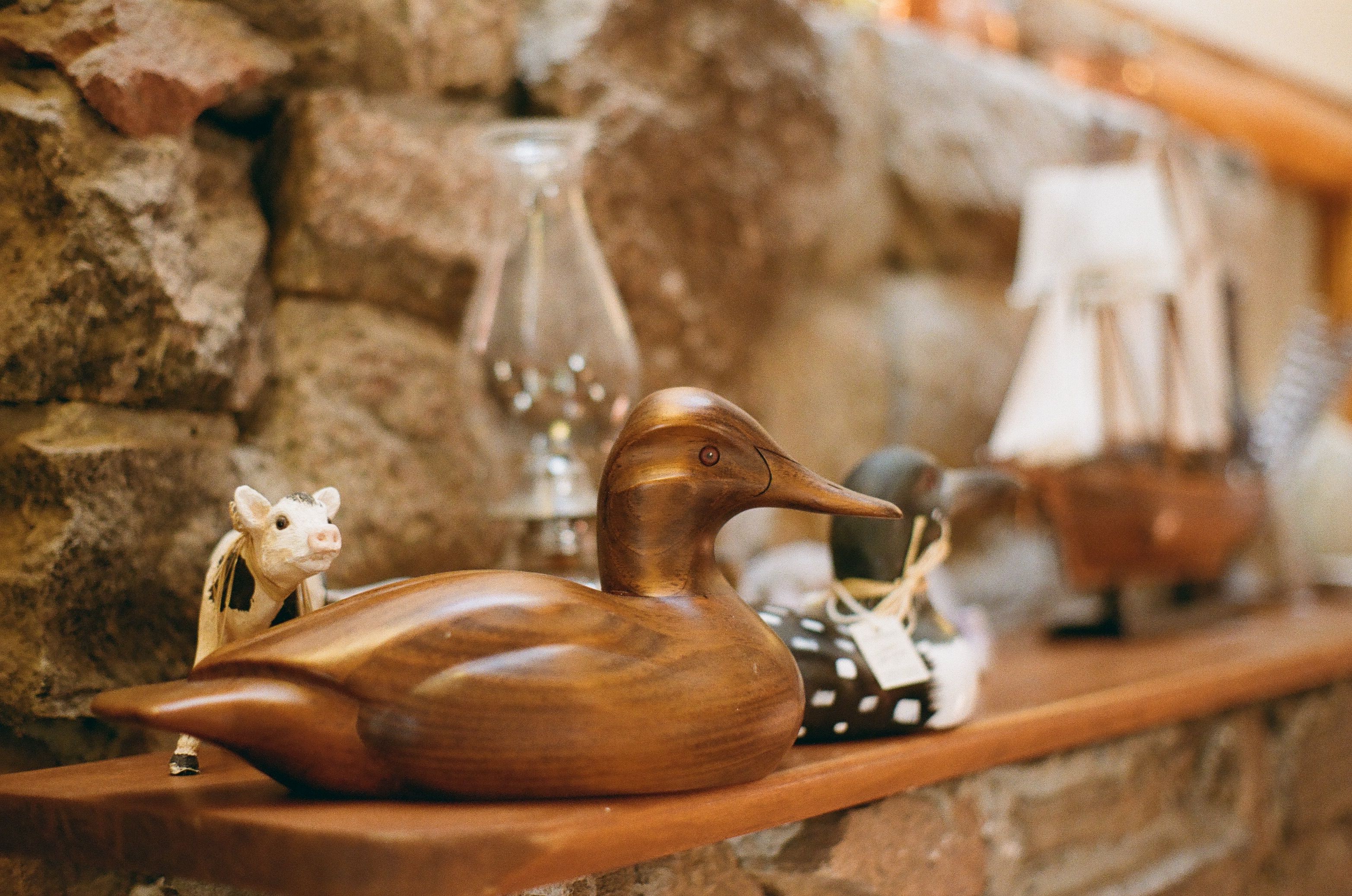 Rustic Shelf with Wooden Duck Decoration · Free Stock Photo