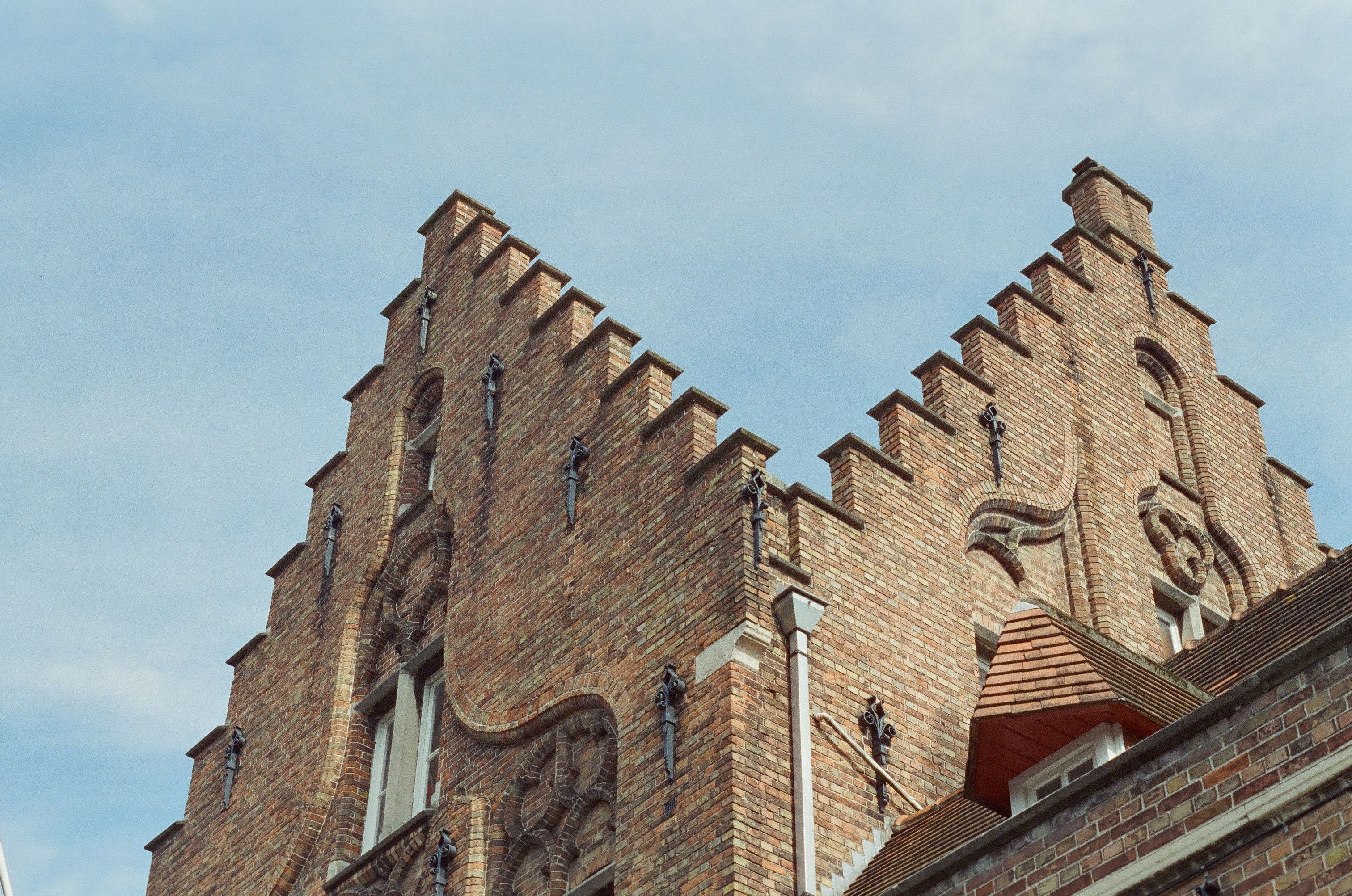 Historic Brick Building with Ornate Architecture · Free Stock Photo