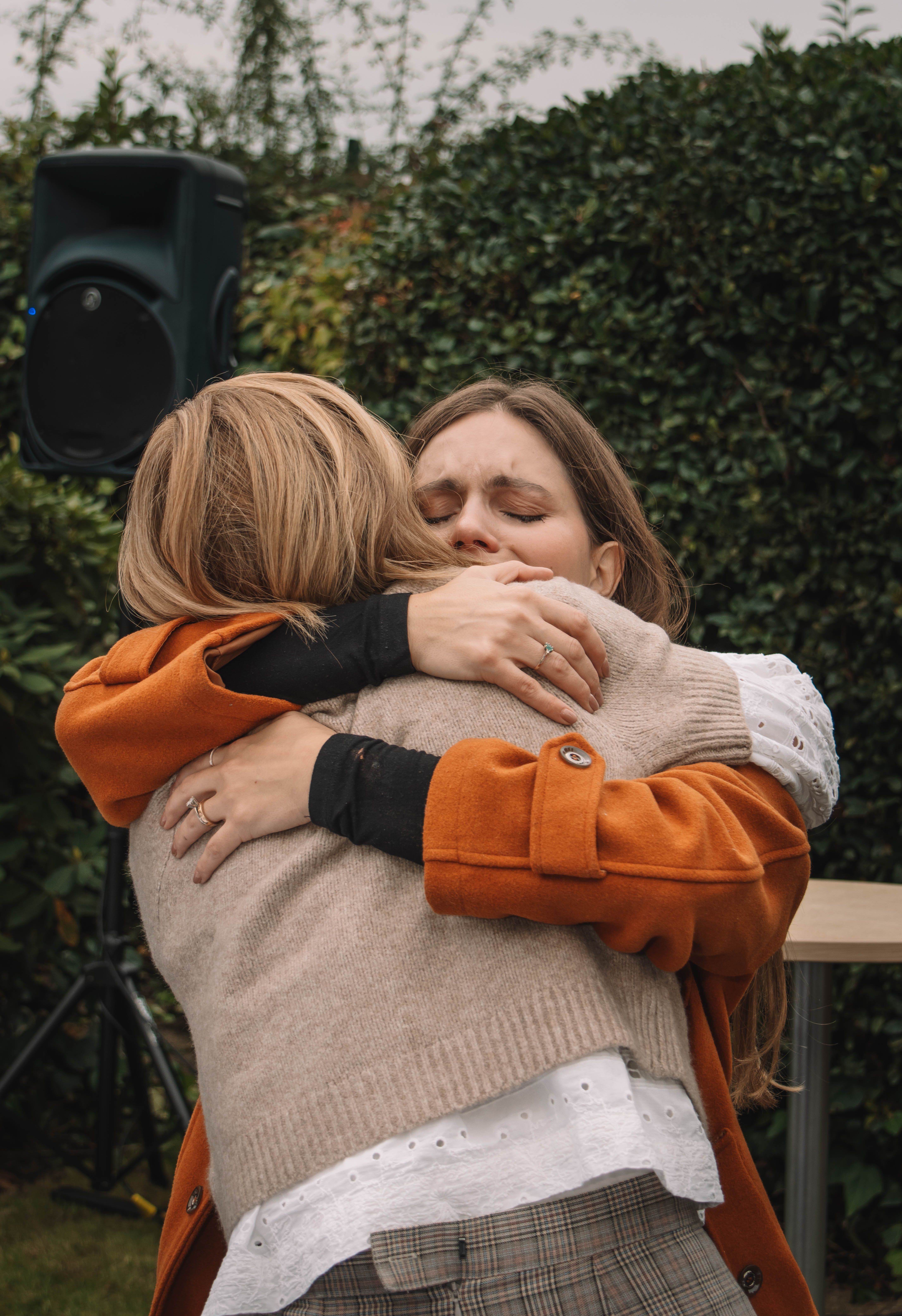 Emotional Embrace Between Two Women Outdoors · Free Stock Photo