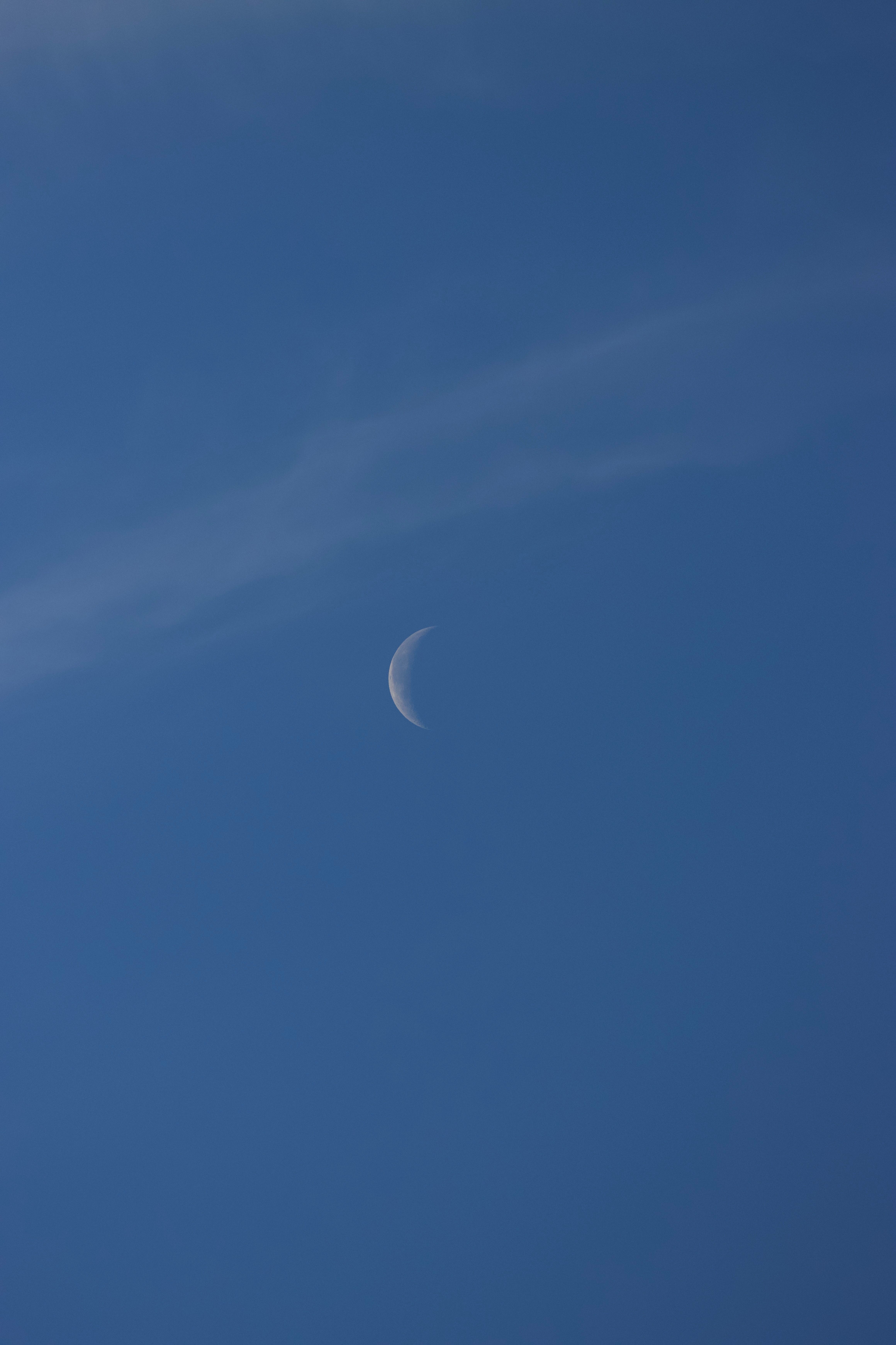 Crescent Moon in Daytime Blue Sky · Free Stock Photo
