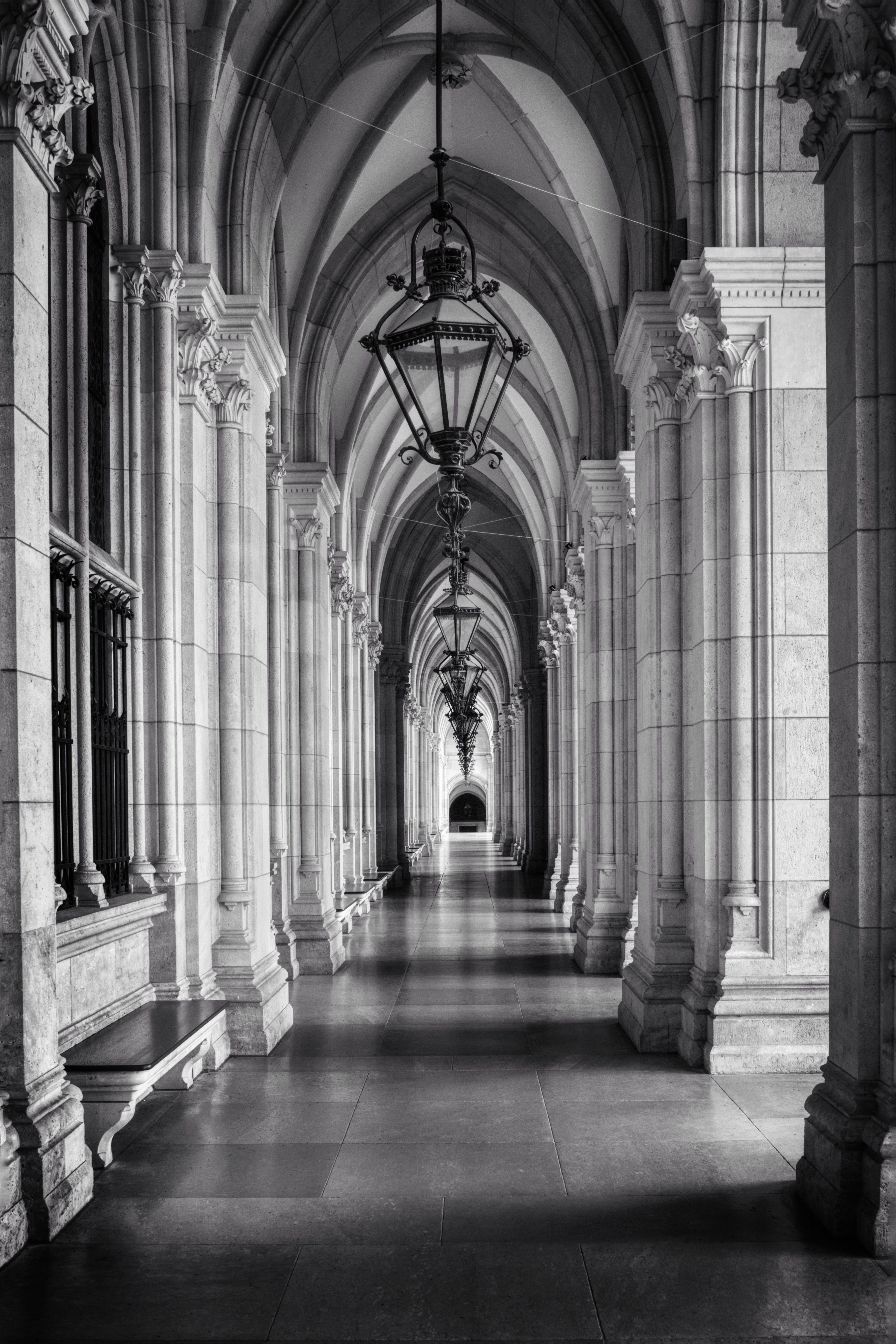 Elegant Gothic Architectural Corridor in Black and White · Free Stock Photo
