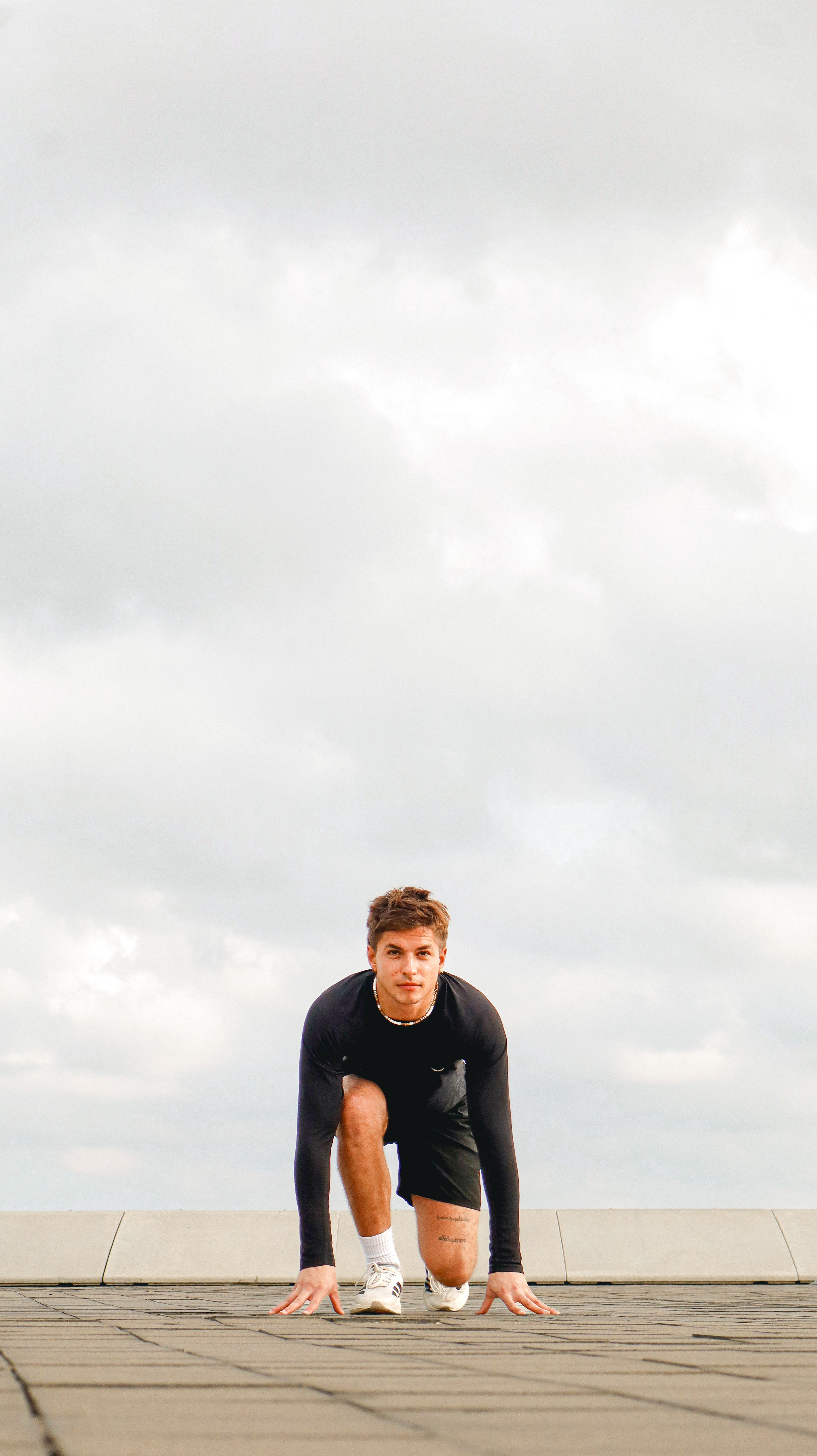 Athlete in Starting Position Ready to Sprint · Free Stock Photo