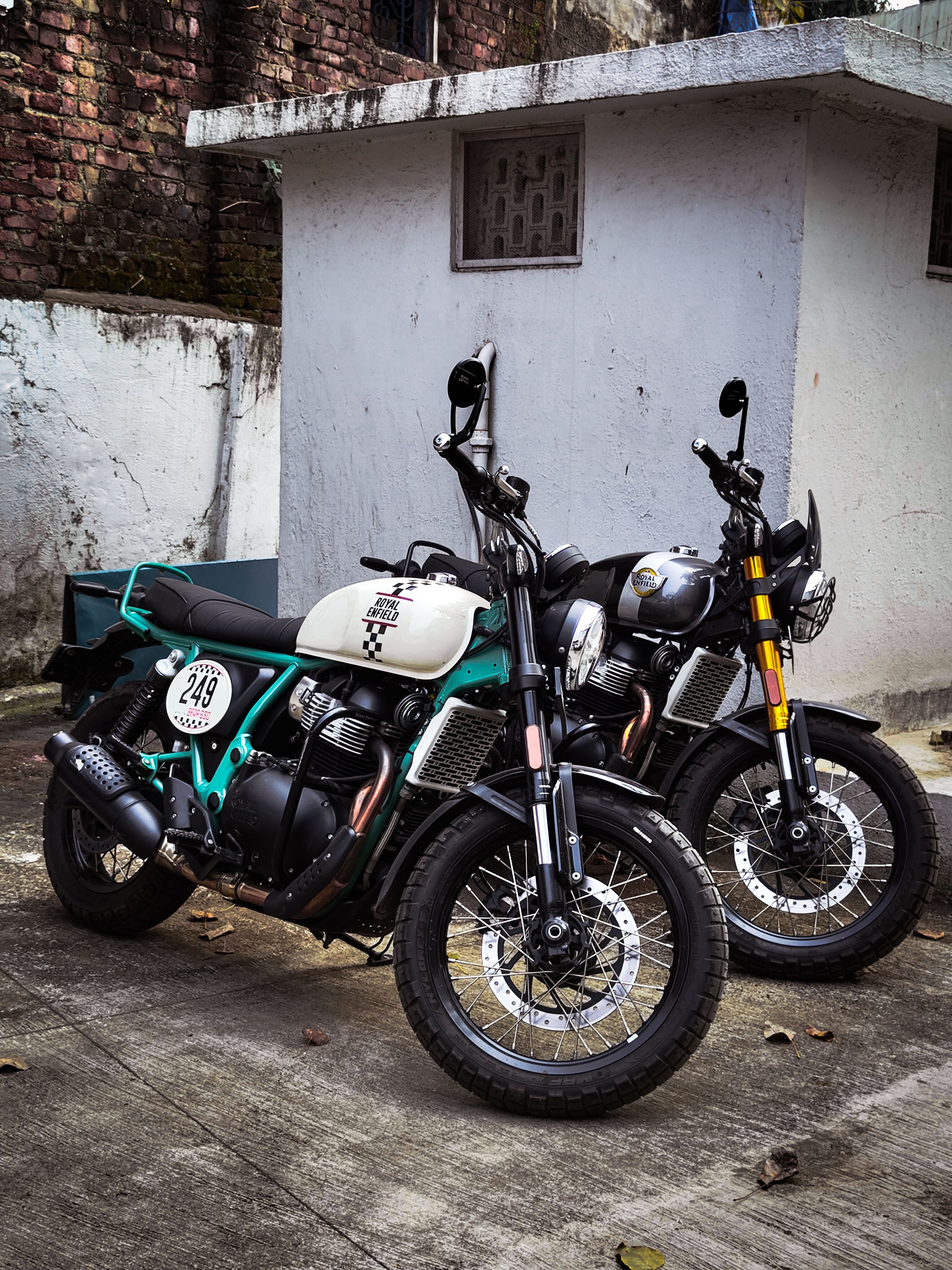 Vintage Motorcycles Parked on Urban Street · Free Stock Photo