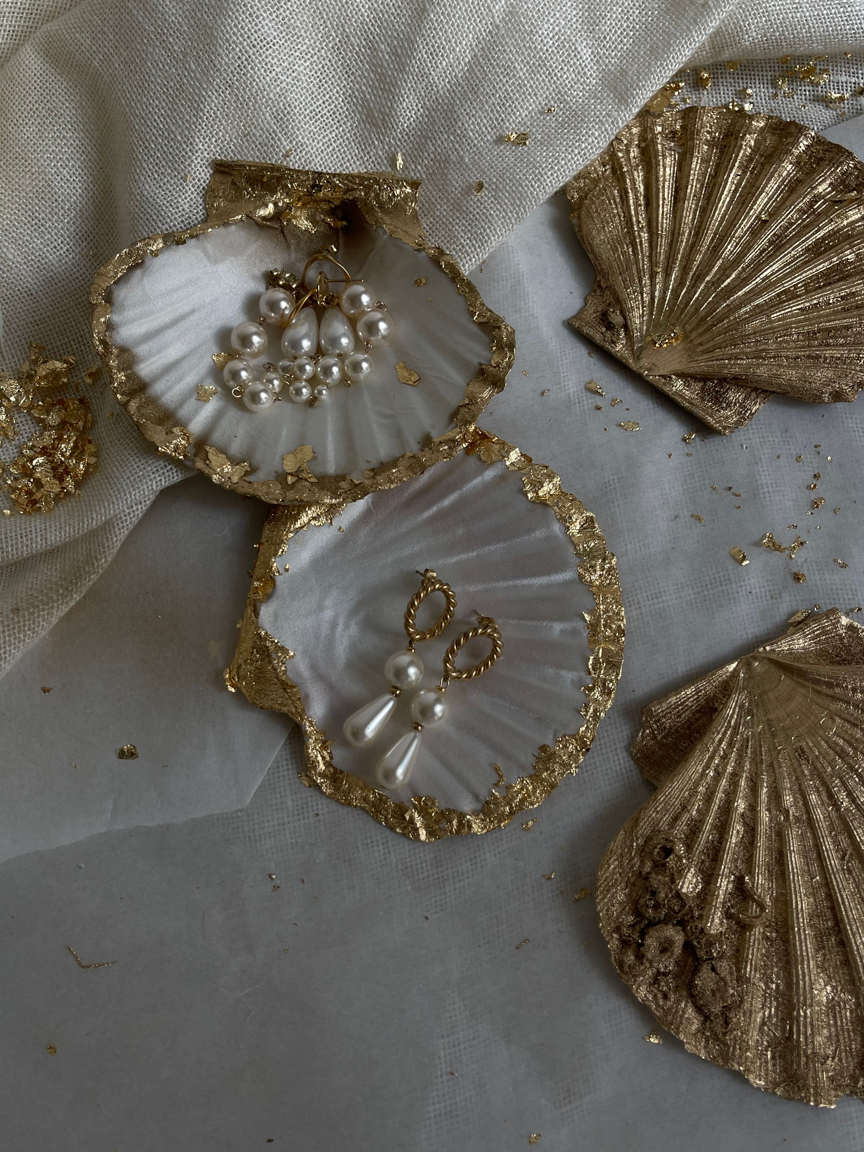 Elegant Gold and Pearl Jewelry on Seashells · Free Stock Photo