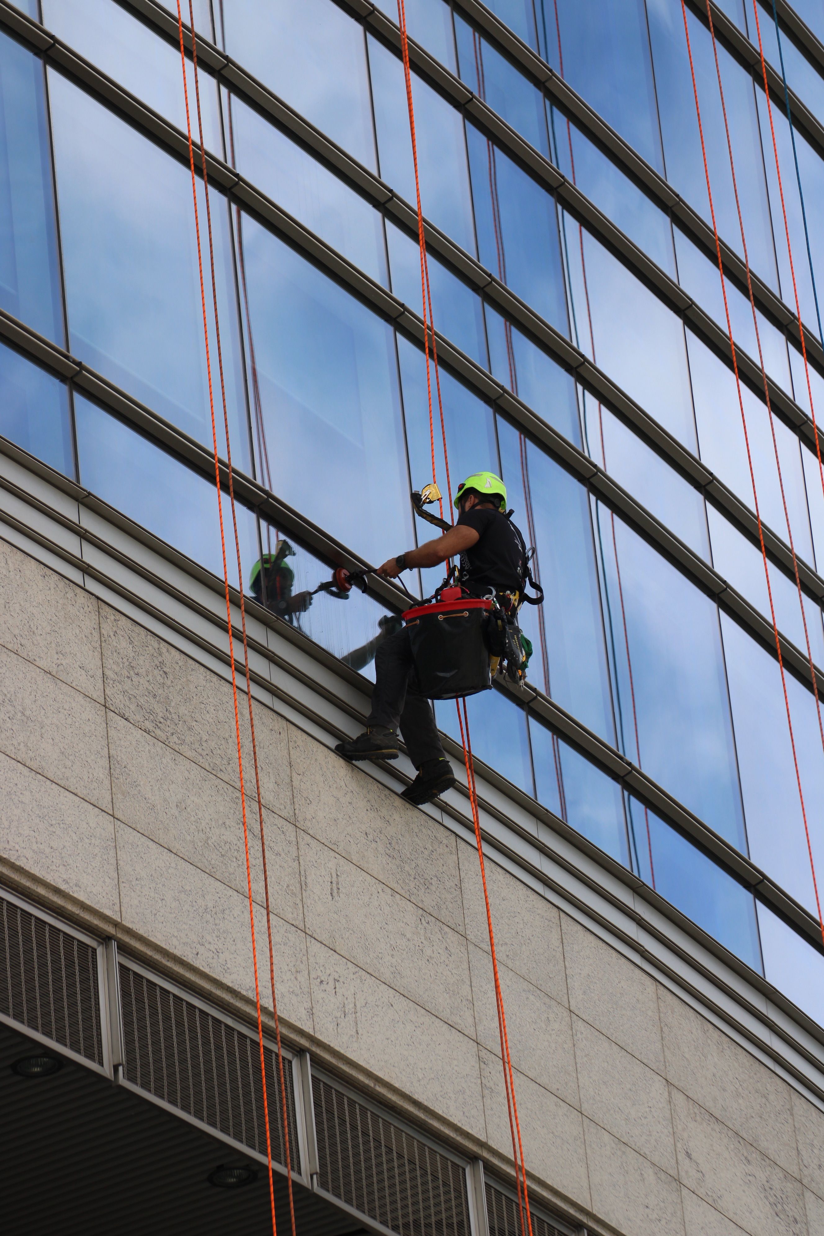 Professional Window Cleaner on Skyscraper · Free Stock Photo