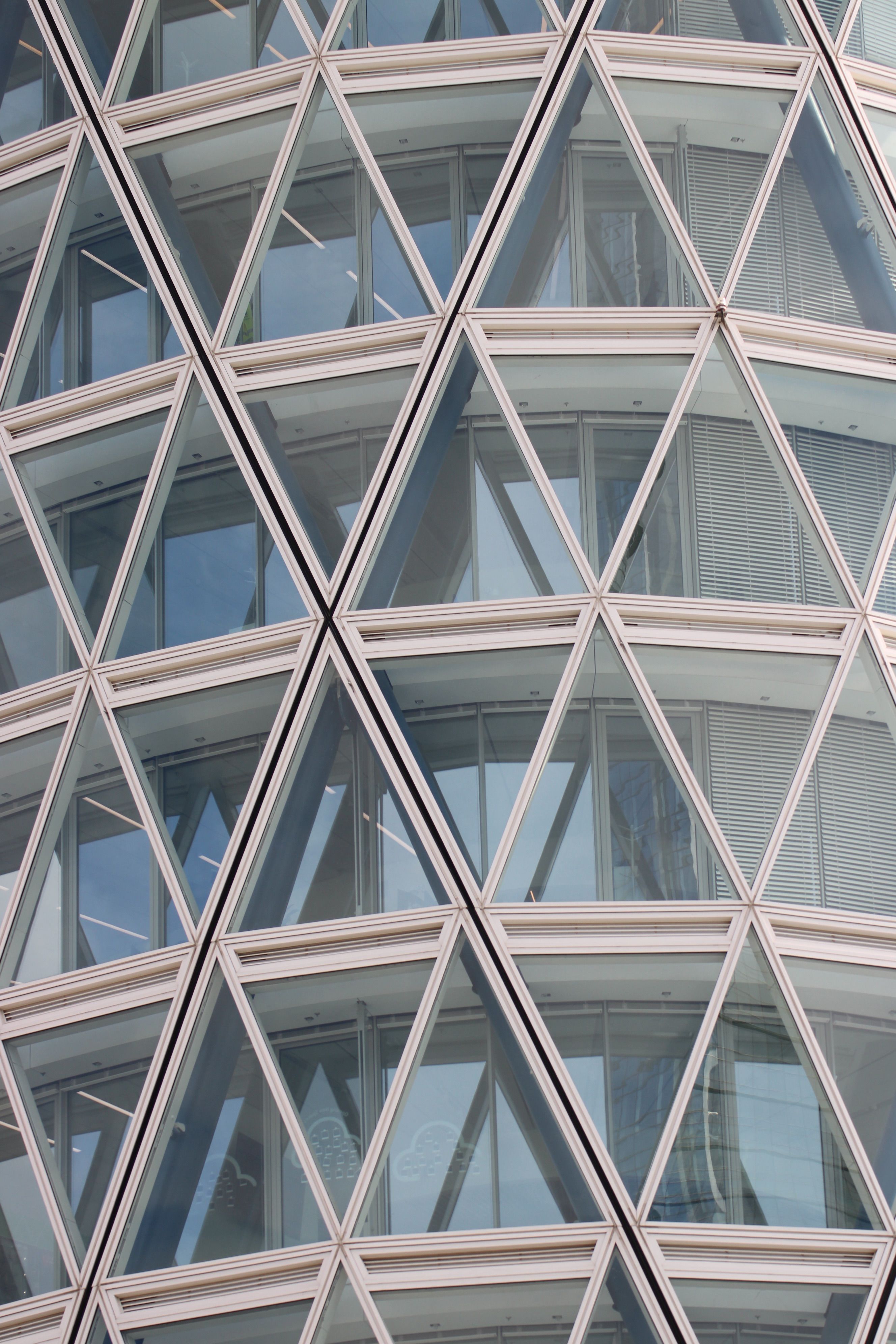 Modern Architectural Facade with Glass Panels · Free Stock Photo