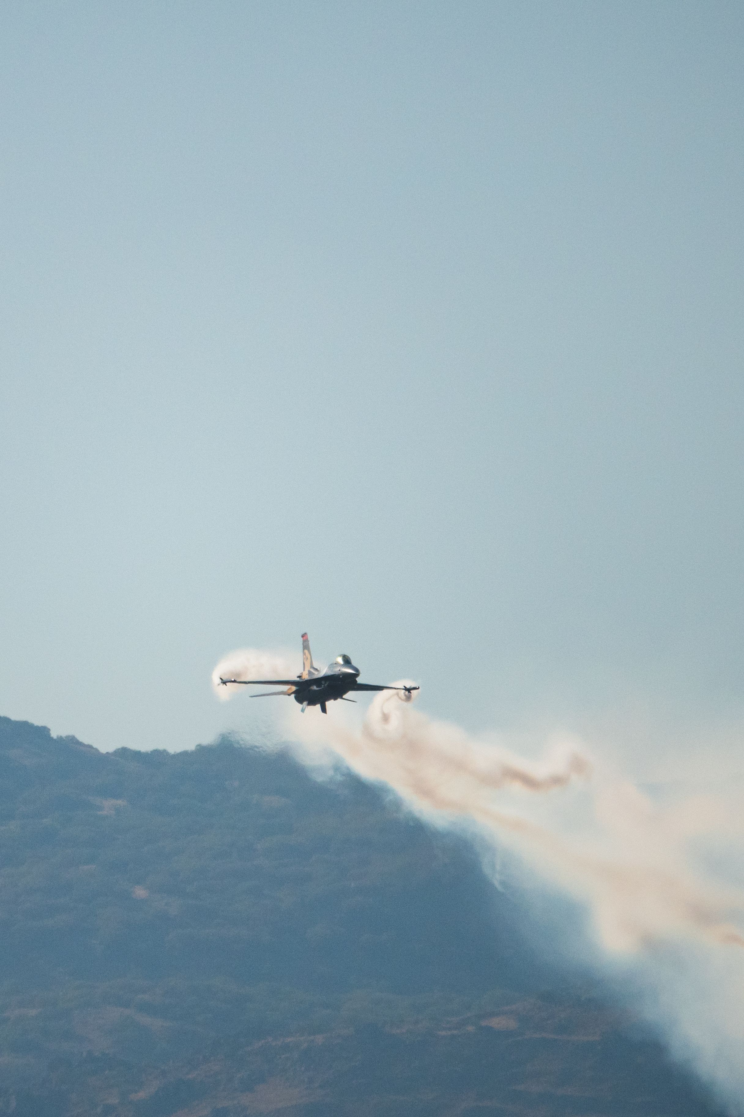 High-Speed Jet Fighter Performing Aerial Maneuvers · Free Stock Photo
