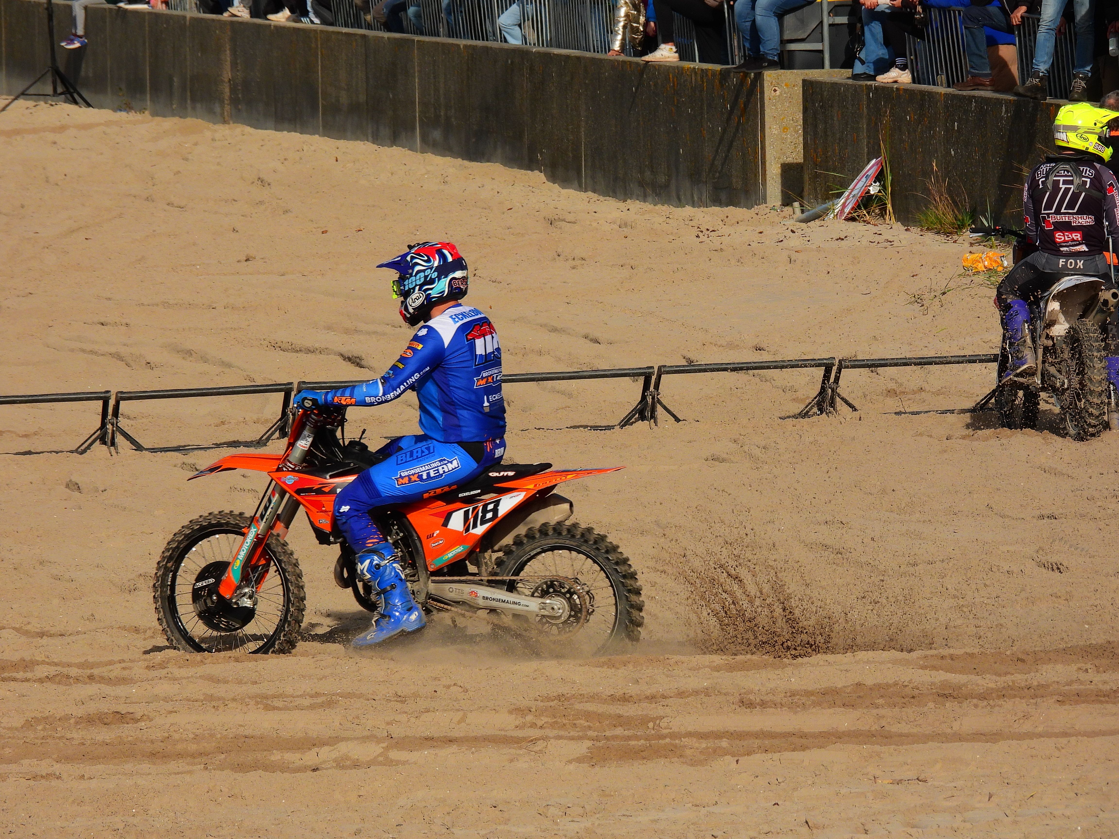 Dynamic Dirt Bike Racing on Sandy Track · Free Stock Photo