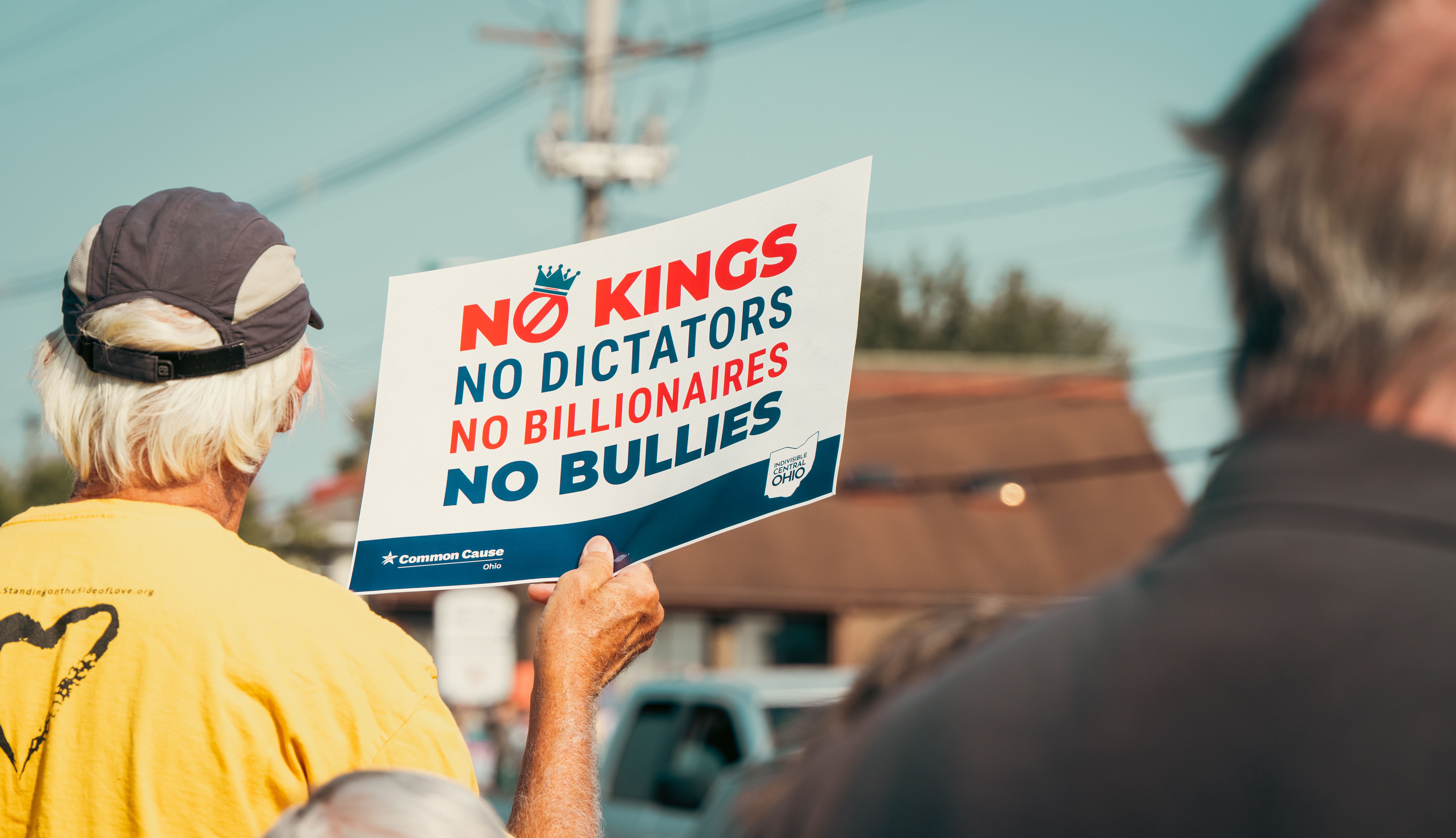 Protestor with Anti-Authority Sign at Rally · Free Stock Photo