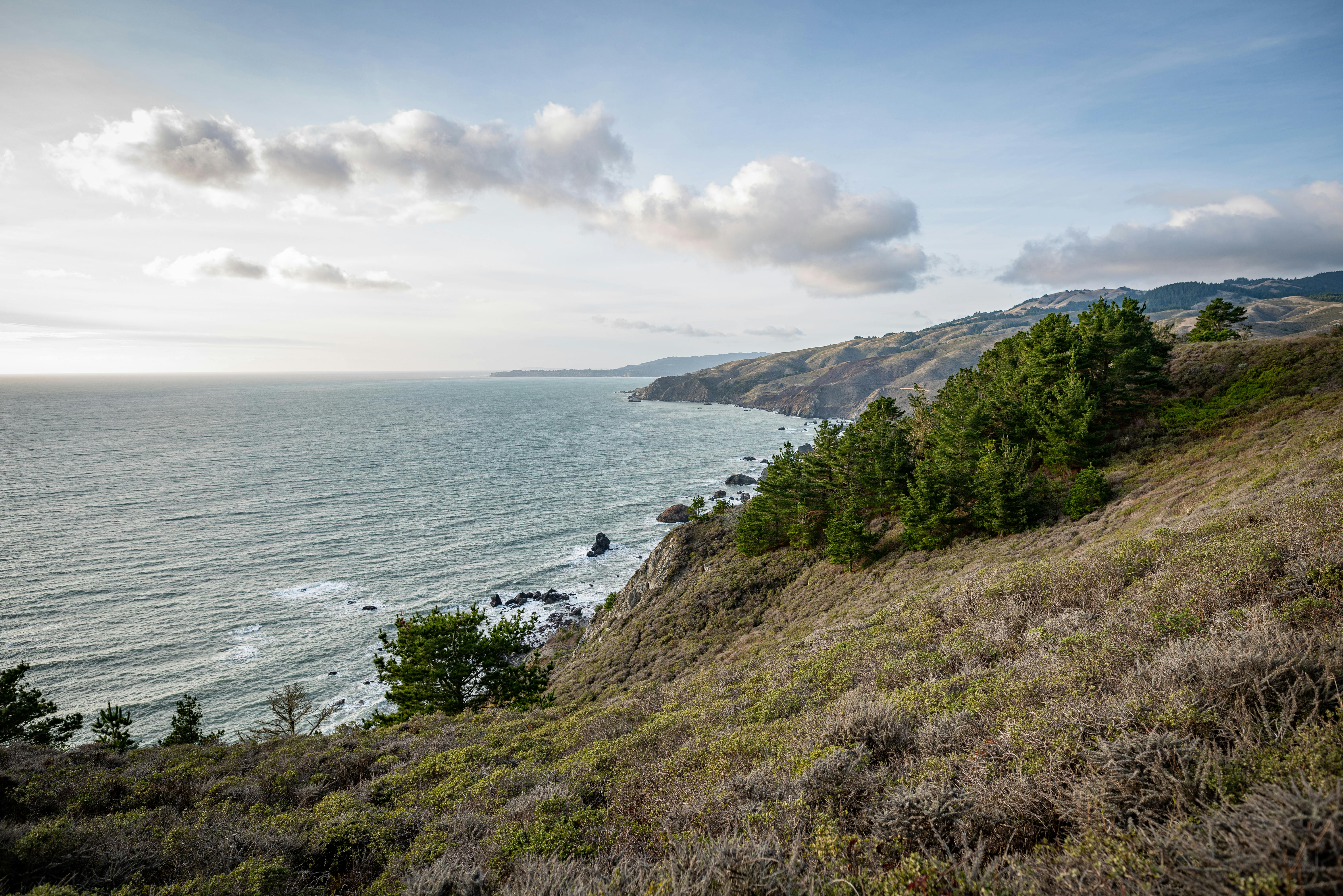 Scenic View of Cliff by Sea · Free Stock Photo