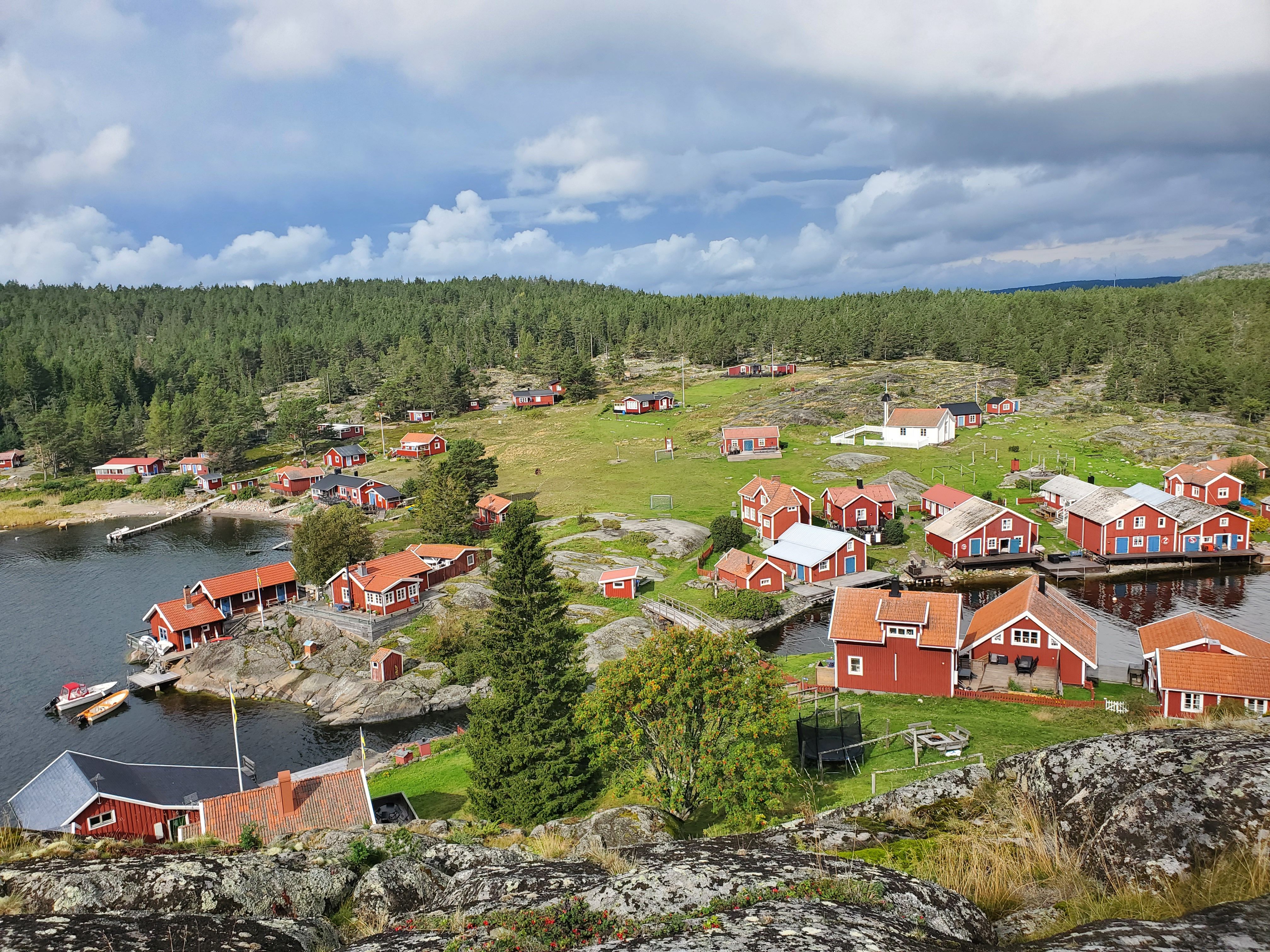Scenic View of Red Cabins by a Nordic Coastline · Free Stock Photo