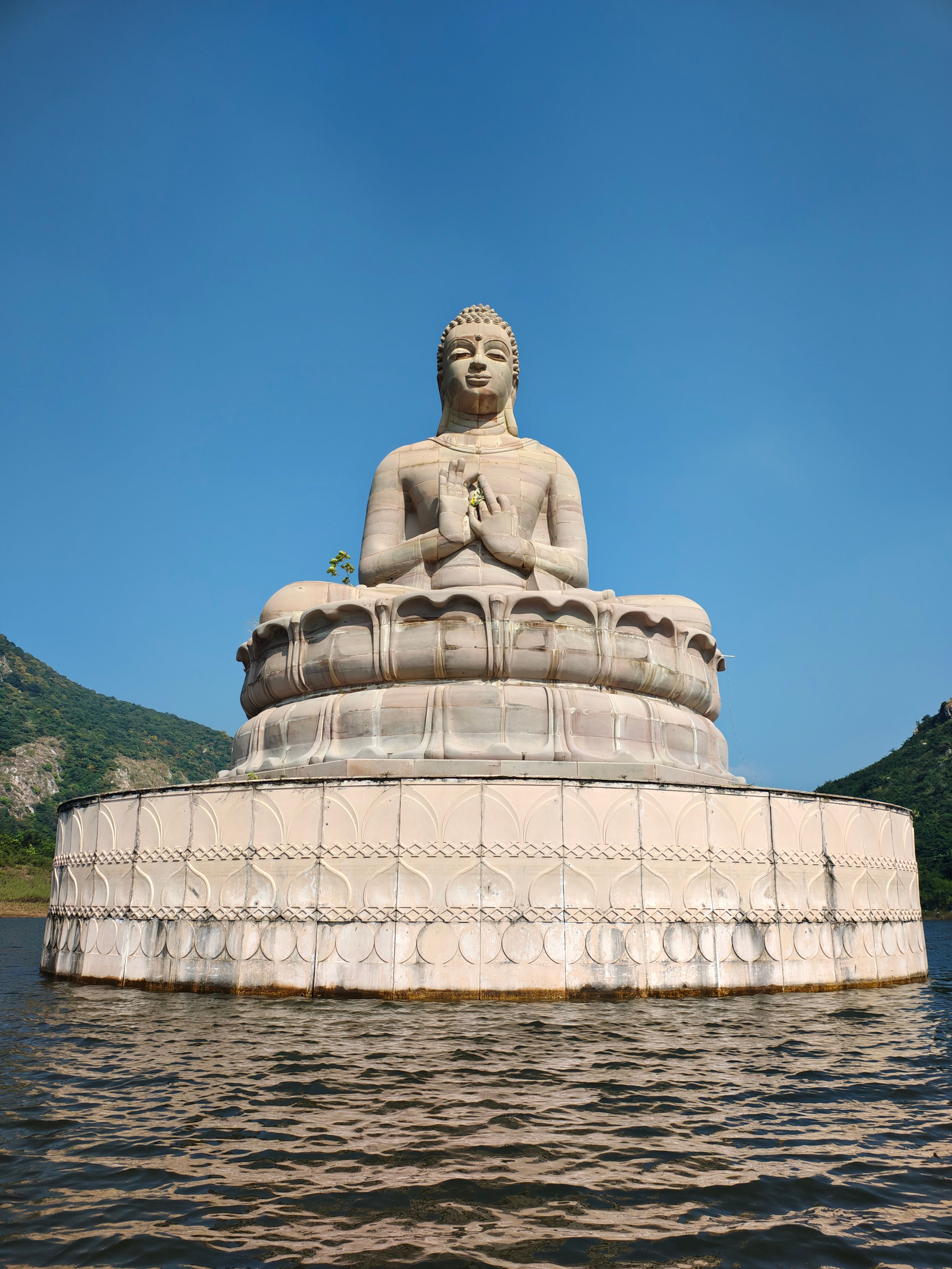 Majestic Buddha Statue in Serene Water Setting · Free Stock Photo
