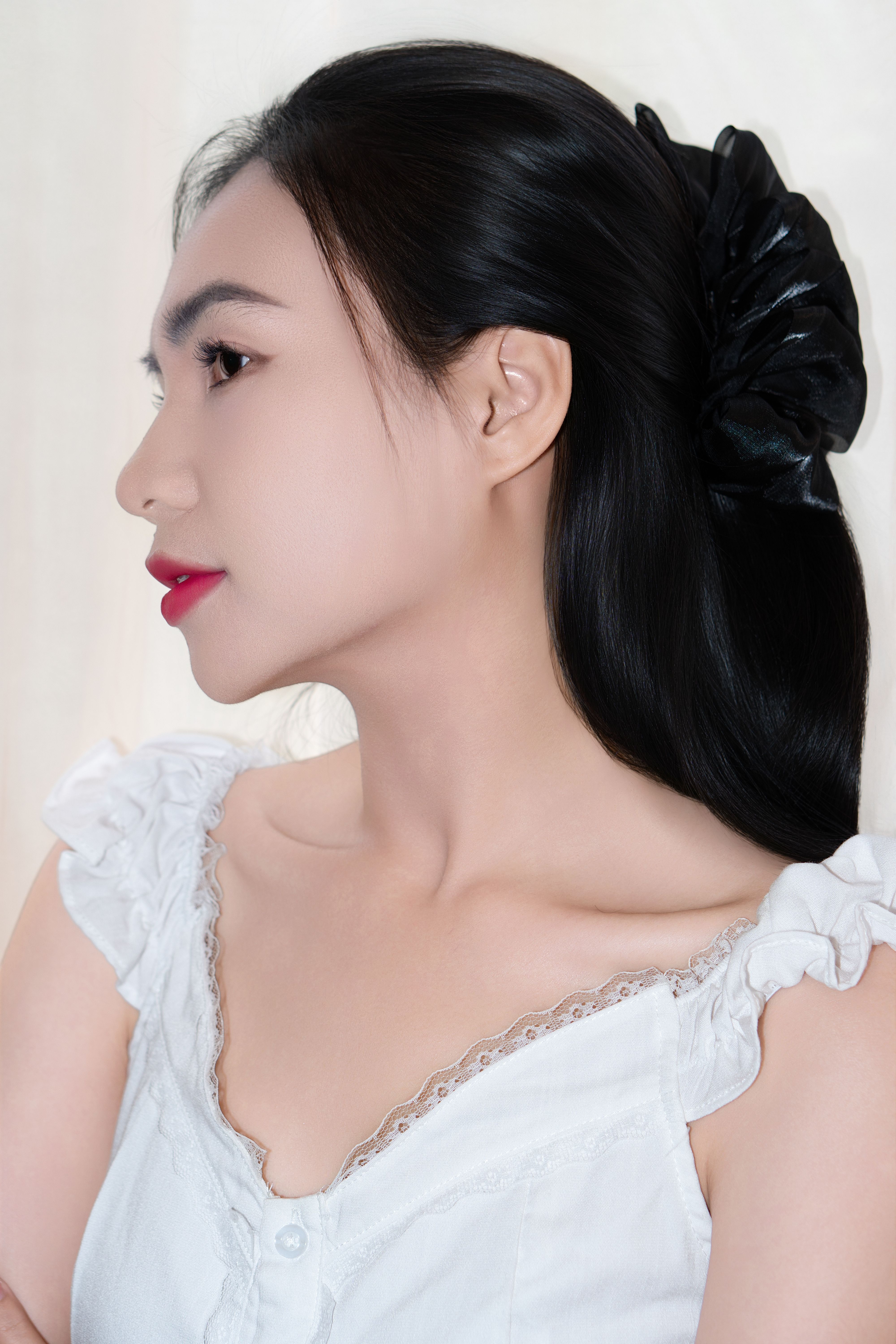 Elegant Portrait of Woman in White Dress Profile View · Free Stock Photo