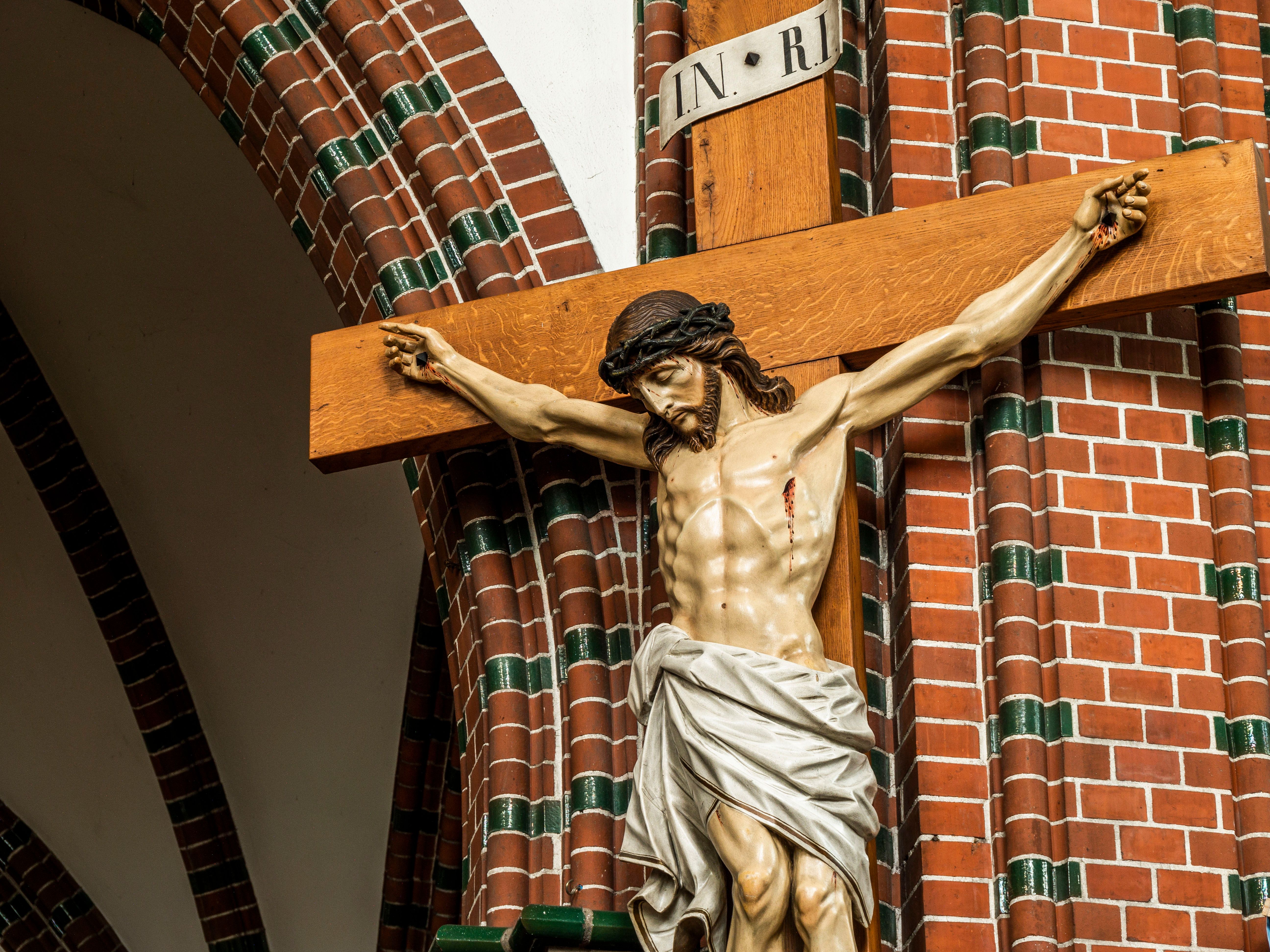 Detailed Crucifixion Sculpture in Brick Church · Free Stock Photo