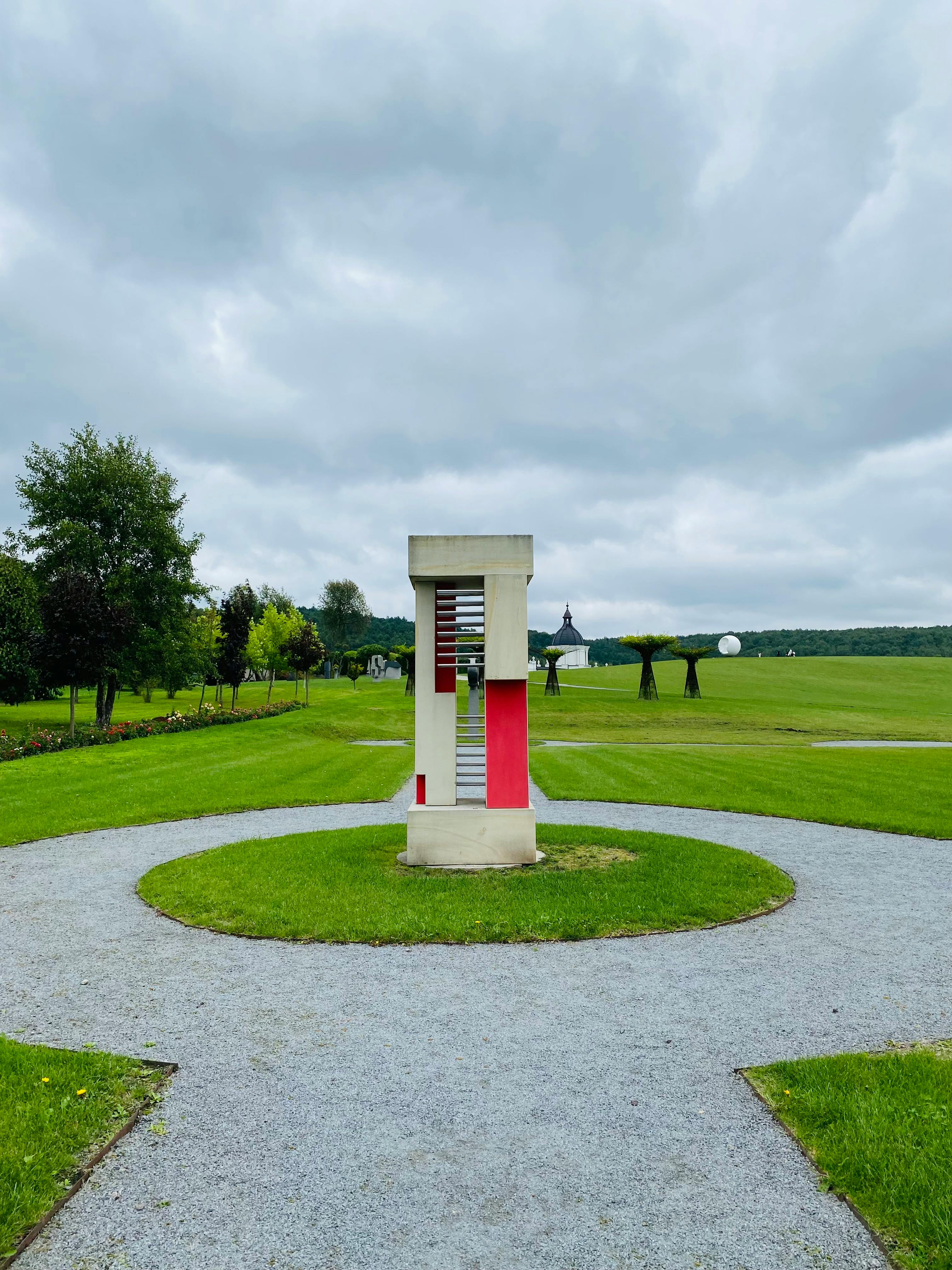 Modern Sculpture in Scenic Park Landscape · Free Stock Photo