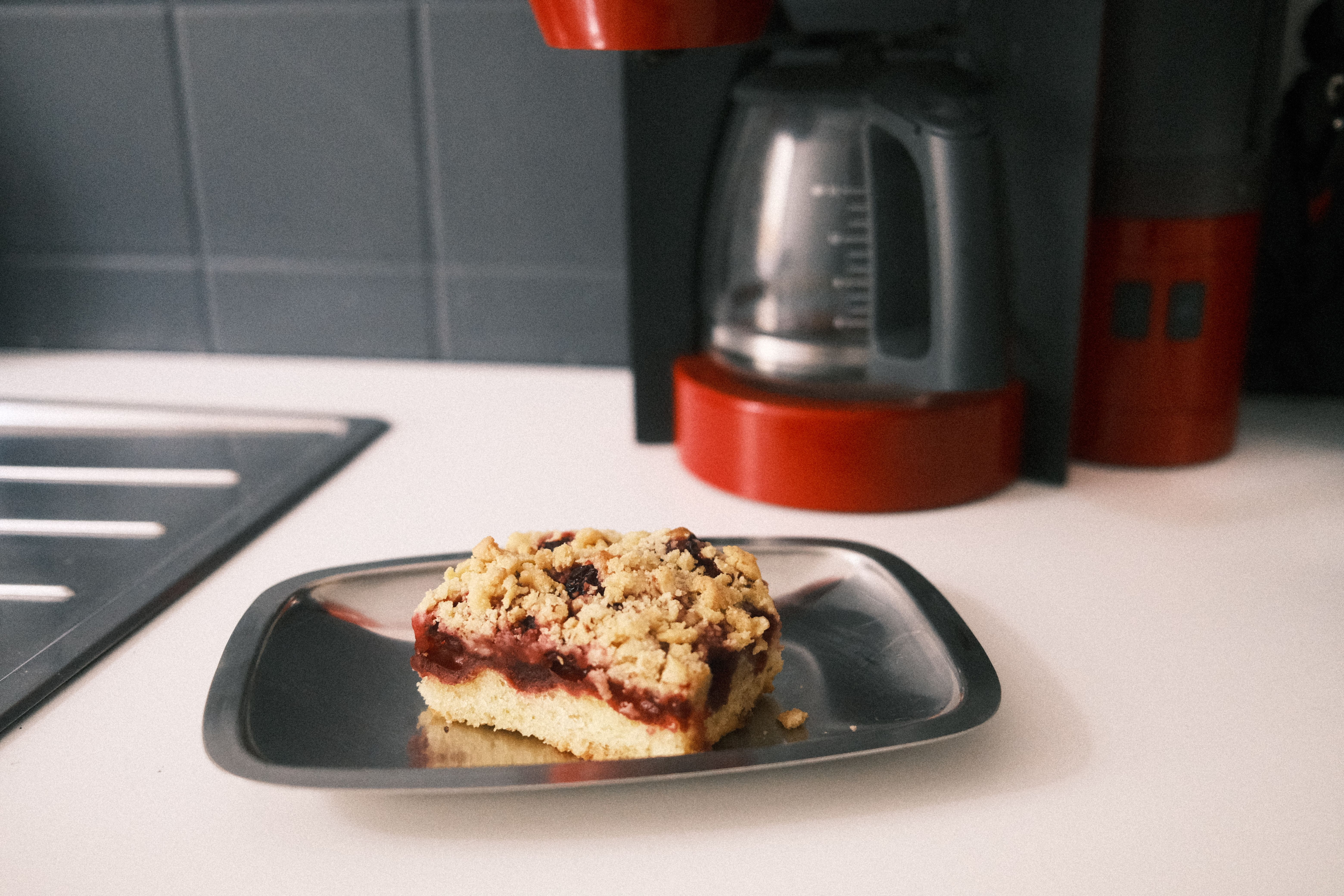 Raspberry Crumble Slice on Kitchen Countertop · Free Stock Photo