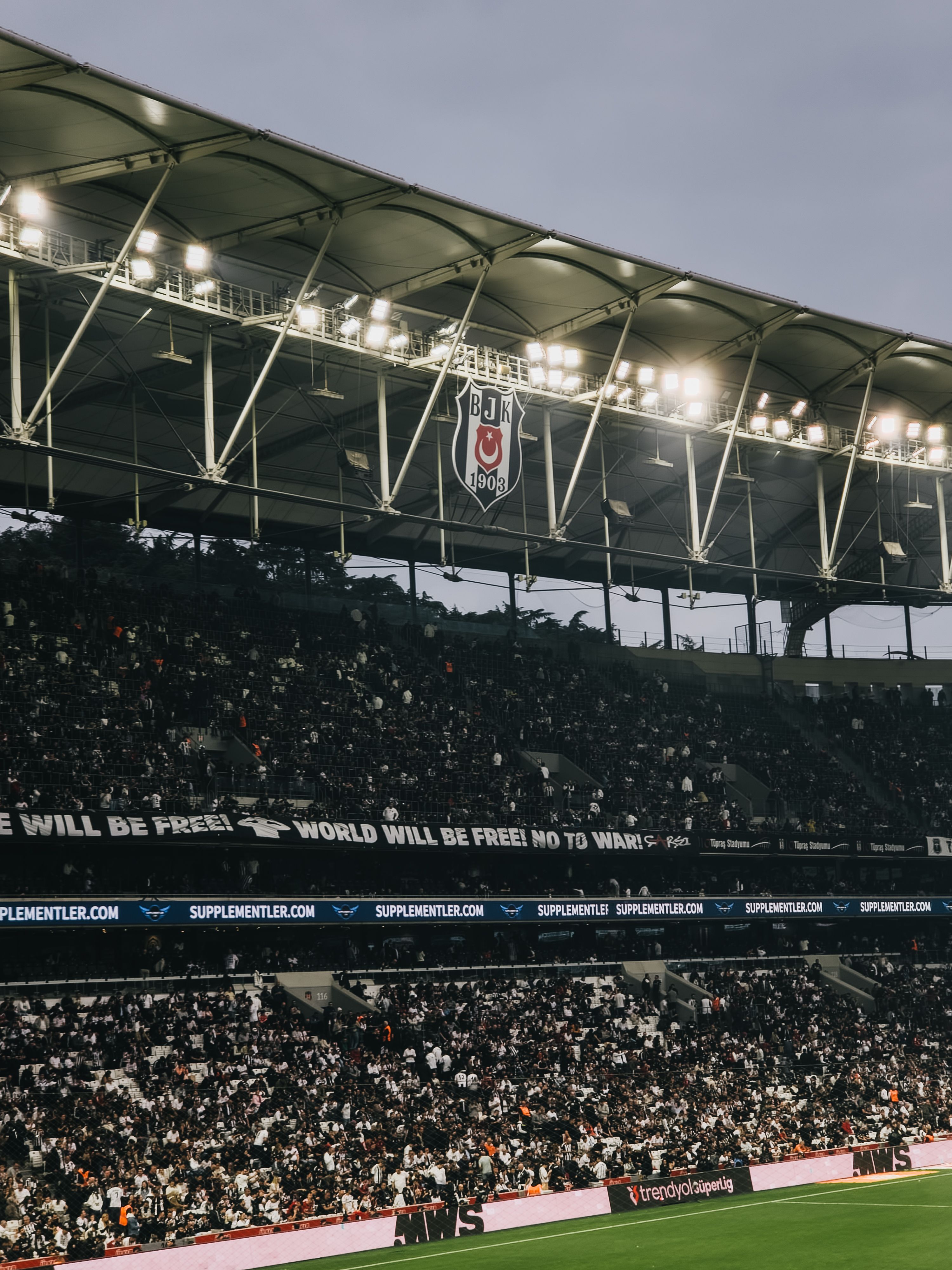 Crowded Soccer Stadium During an Evening Match · Free Stock Photo