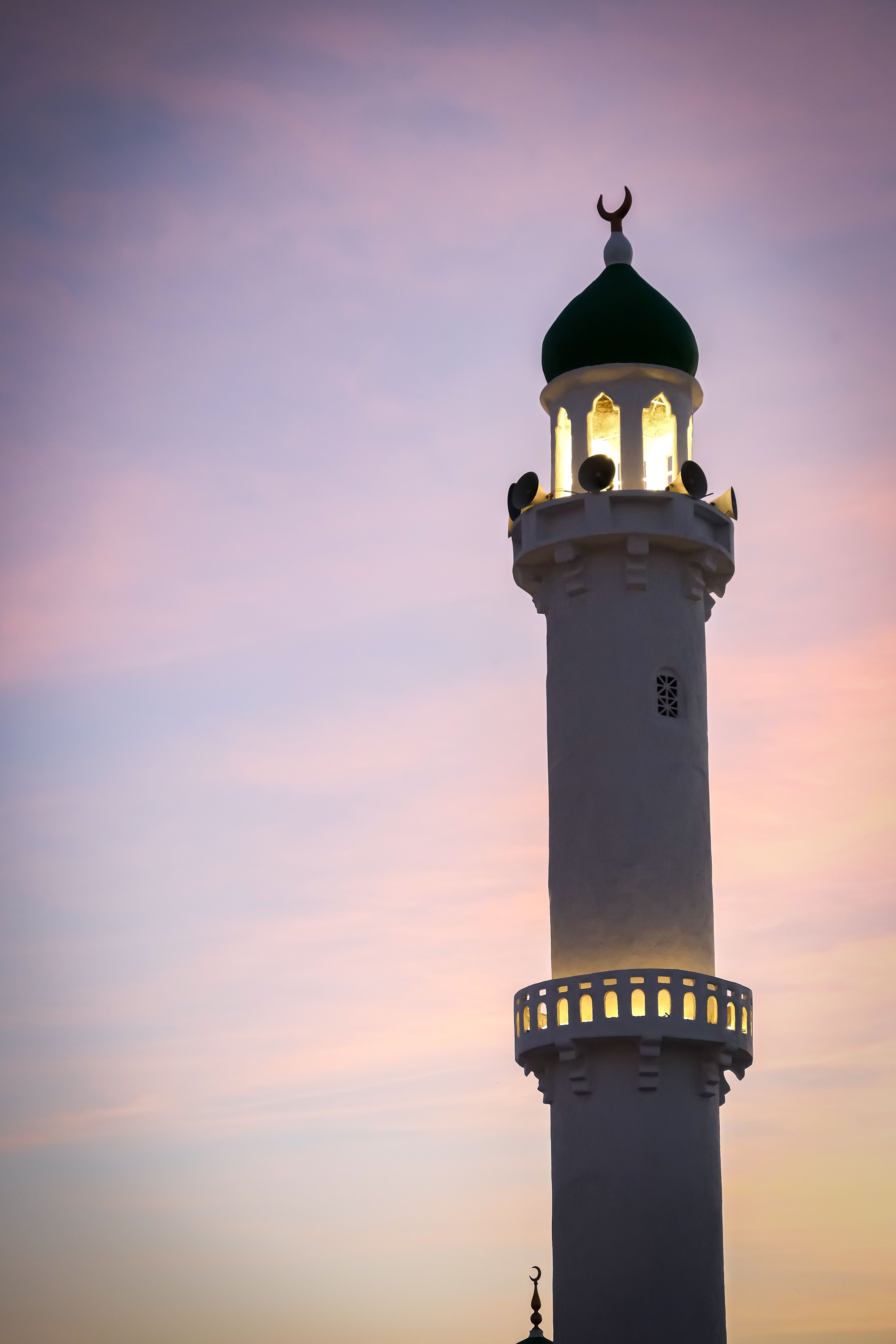 Majestic Minaret at Sunset with Colorful Sky · Free Stock Photo