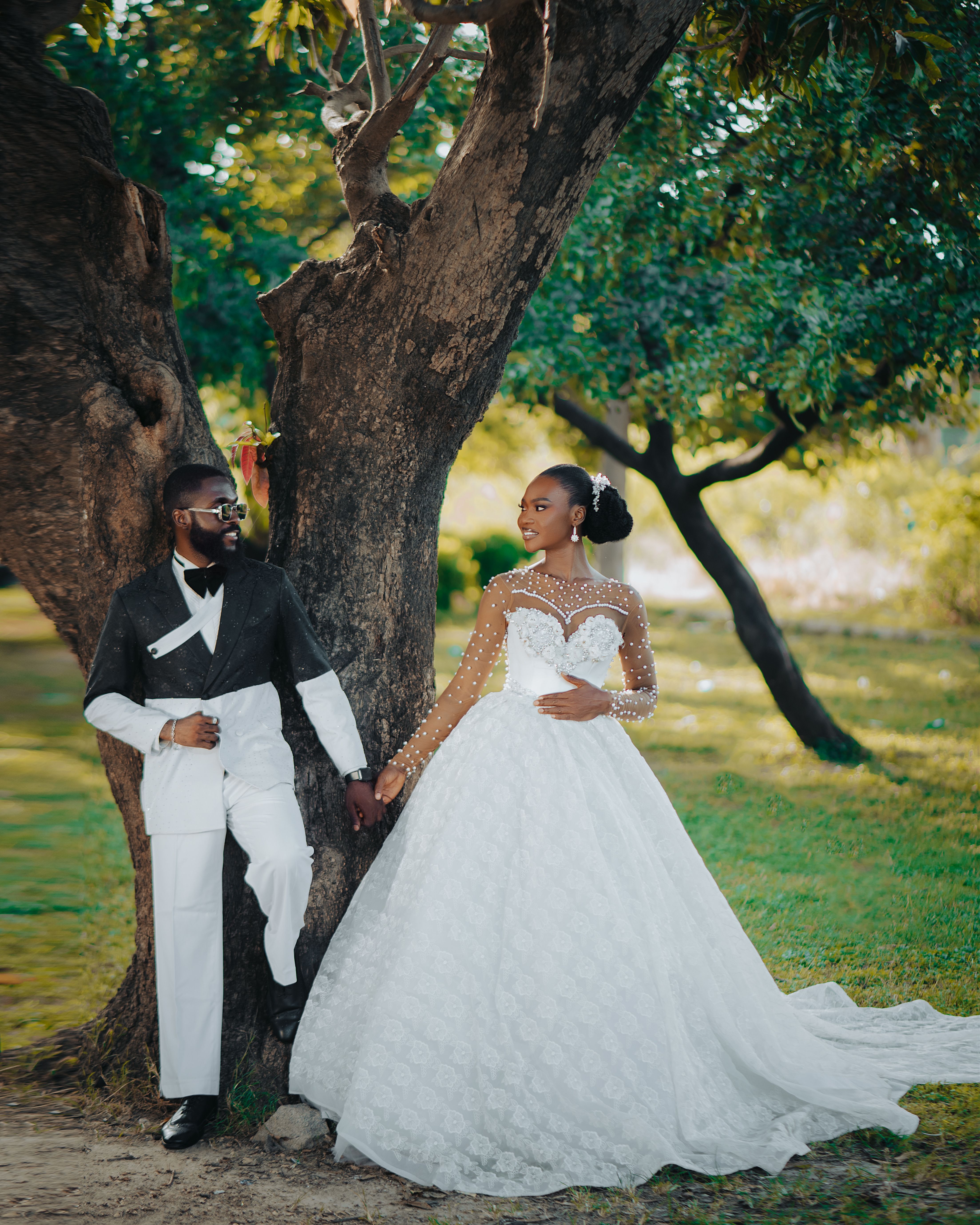 Elegant Outdoor Wedding Portrait Under Tree · Free Stock Photo