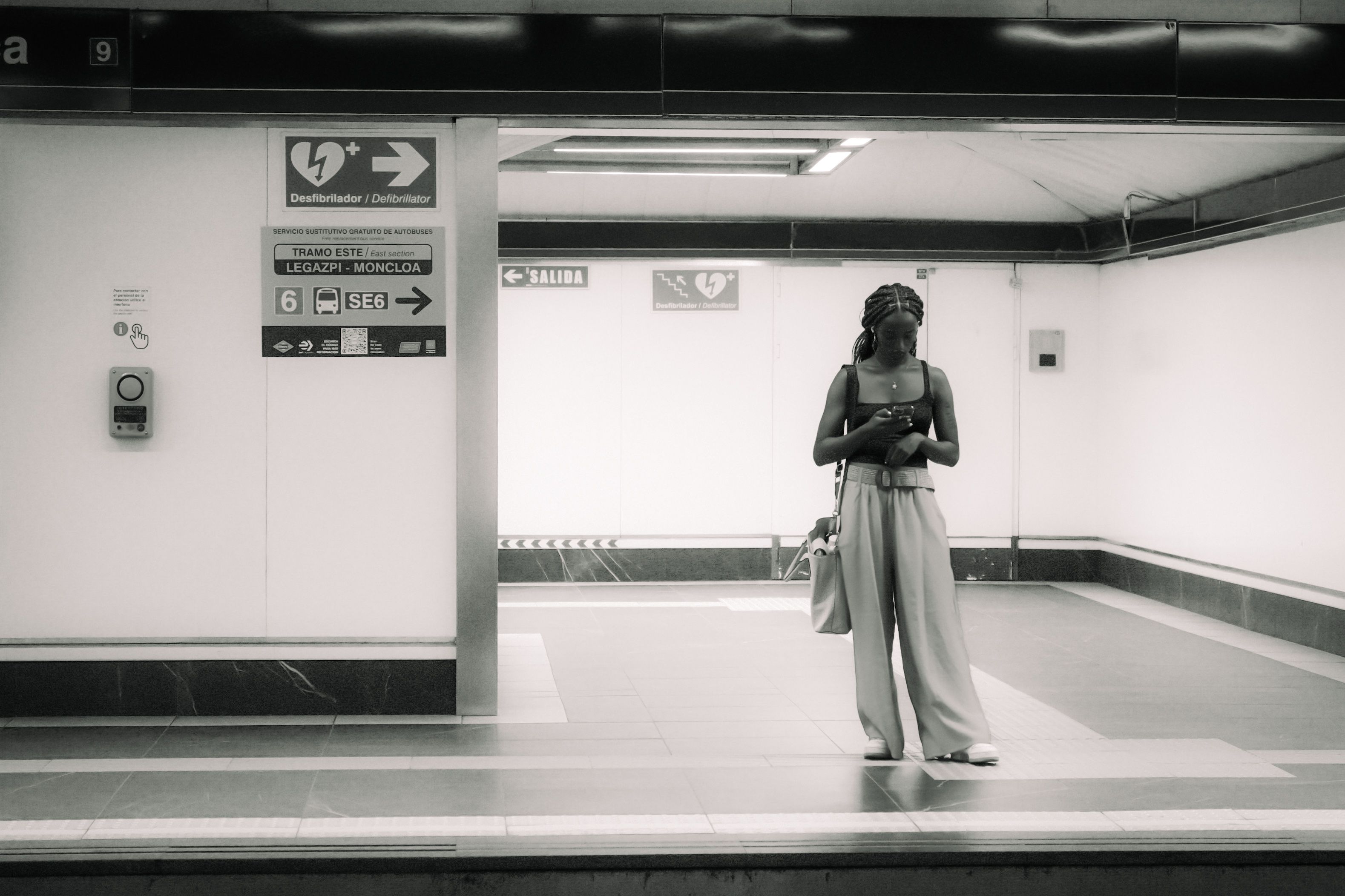 Contemplative Woman Waiting at Subway Station · Free Stock Photo