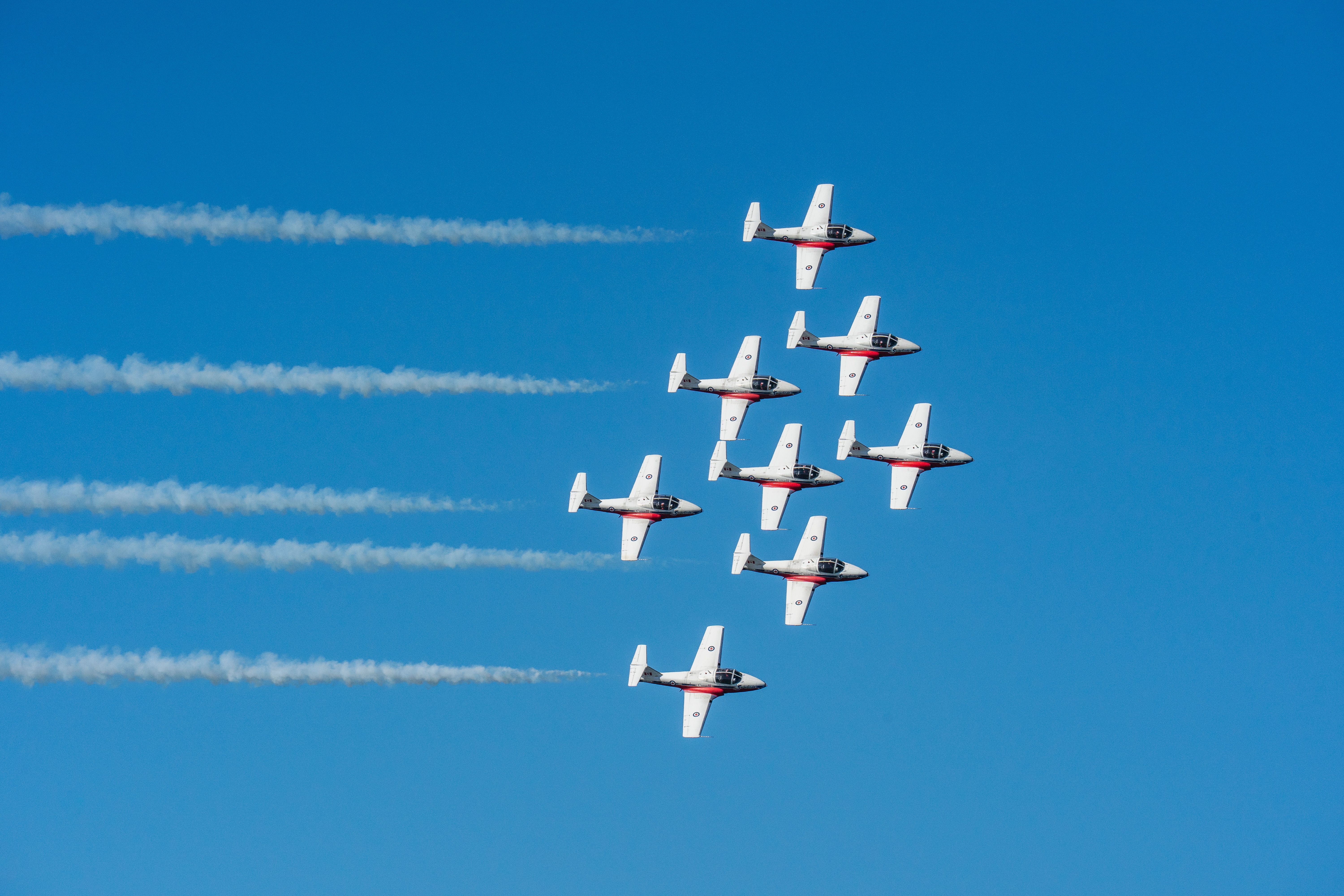 Aerial View of Jet Formation Against Blue Sky · Free Stock Photo