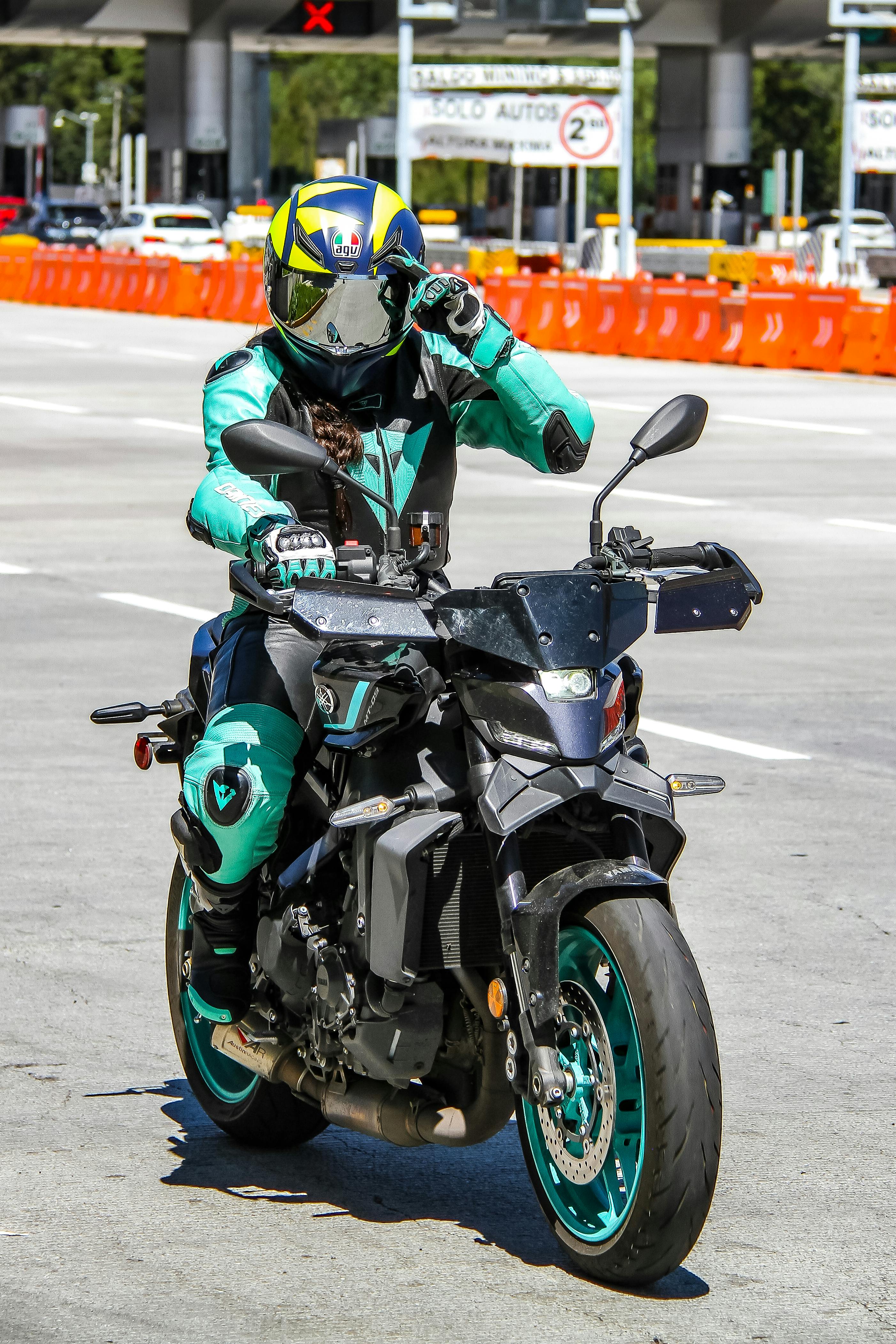 Motorcycle Rider on Track with Helmet · Free Stock Photo