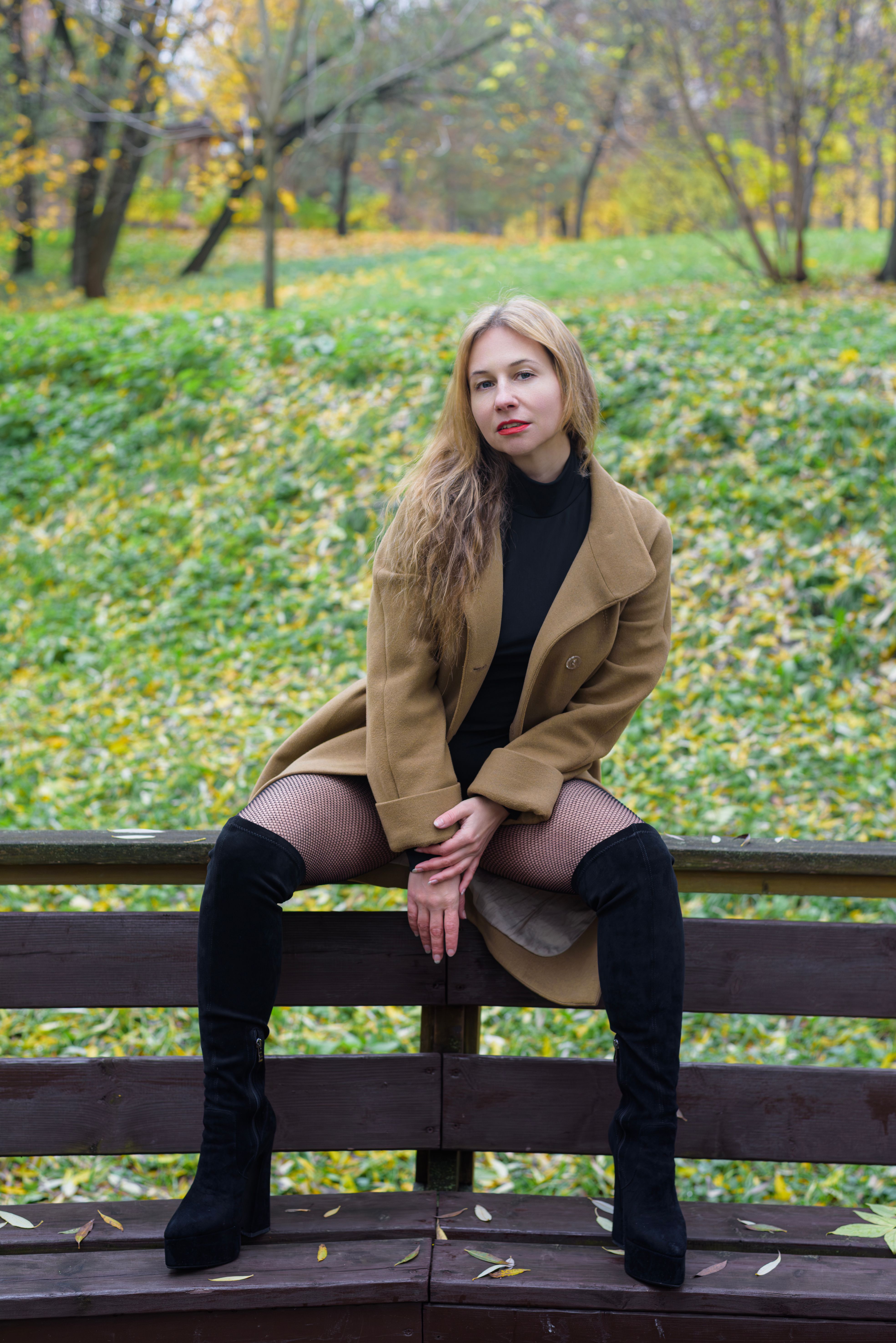Stylish Woman in Park Bench During Fall · Free Stock Photo