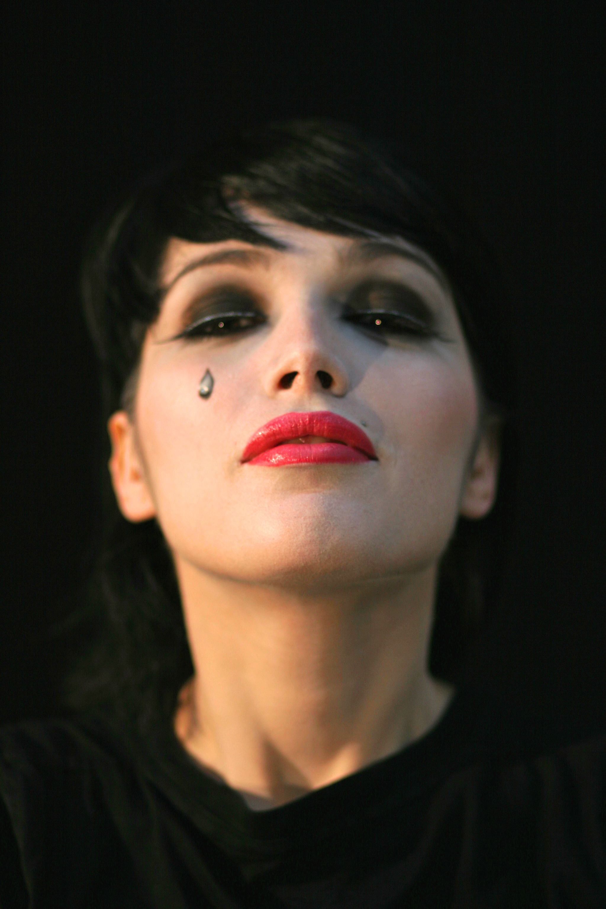 Portrait of Woman with Dramatic Makeup on Black Background · Free Stock ...
