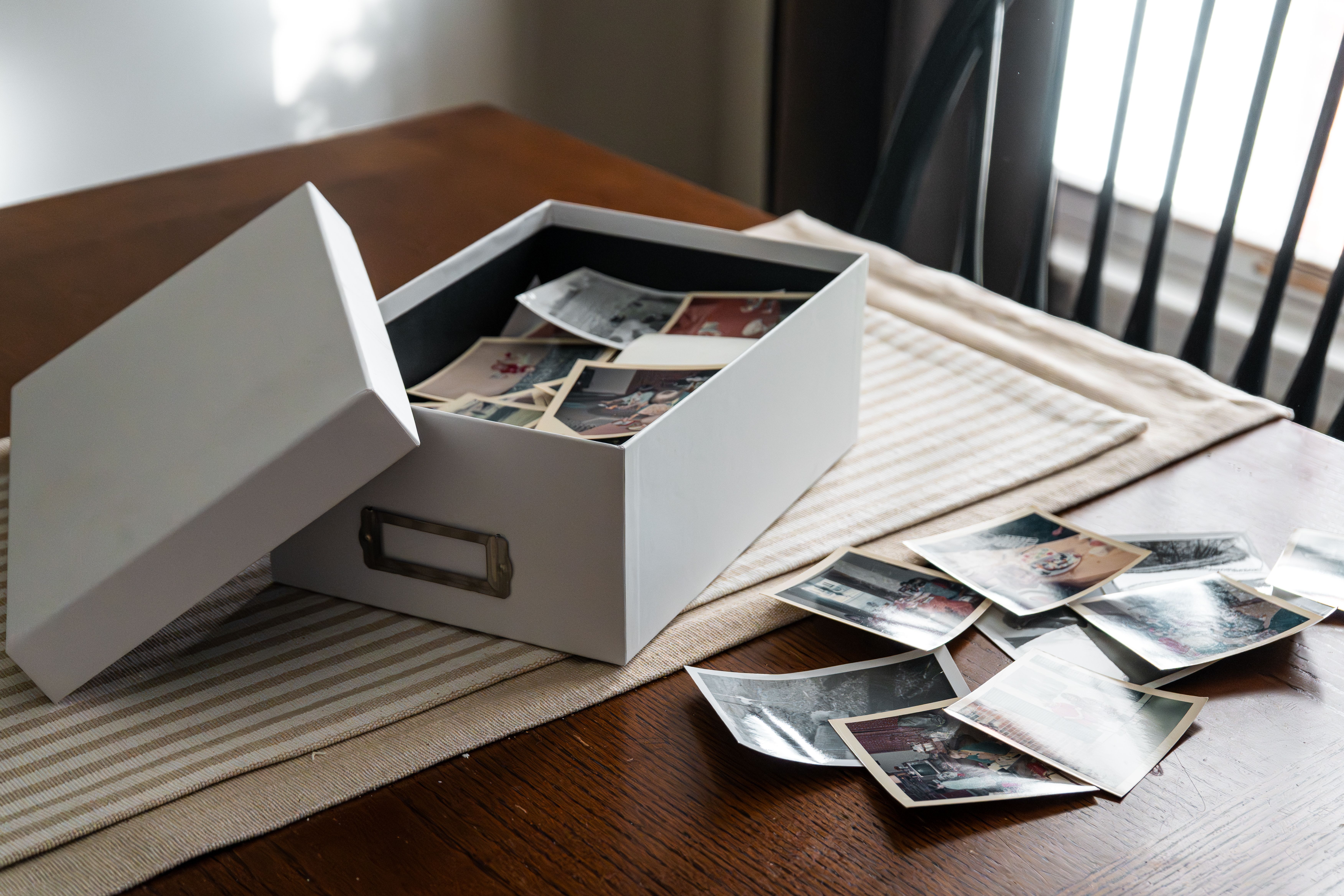 Vintage Photo Box with Retro Family Pictures · Free Stock Photo